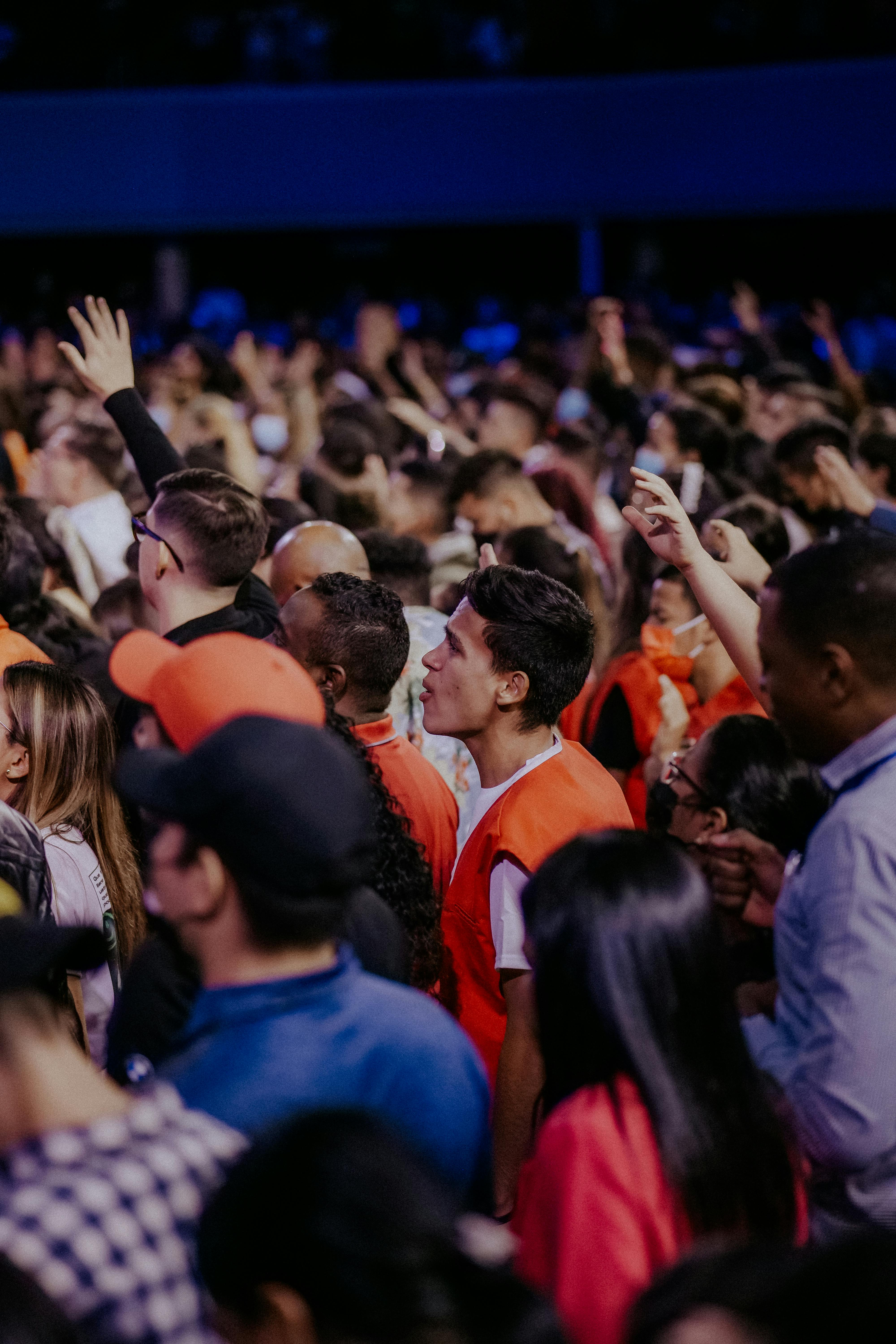 Audience Standing in an Auditorium during an Event · Free Stock Photo
