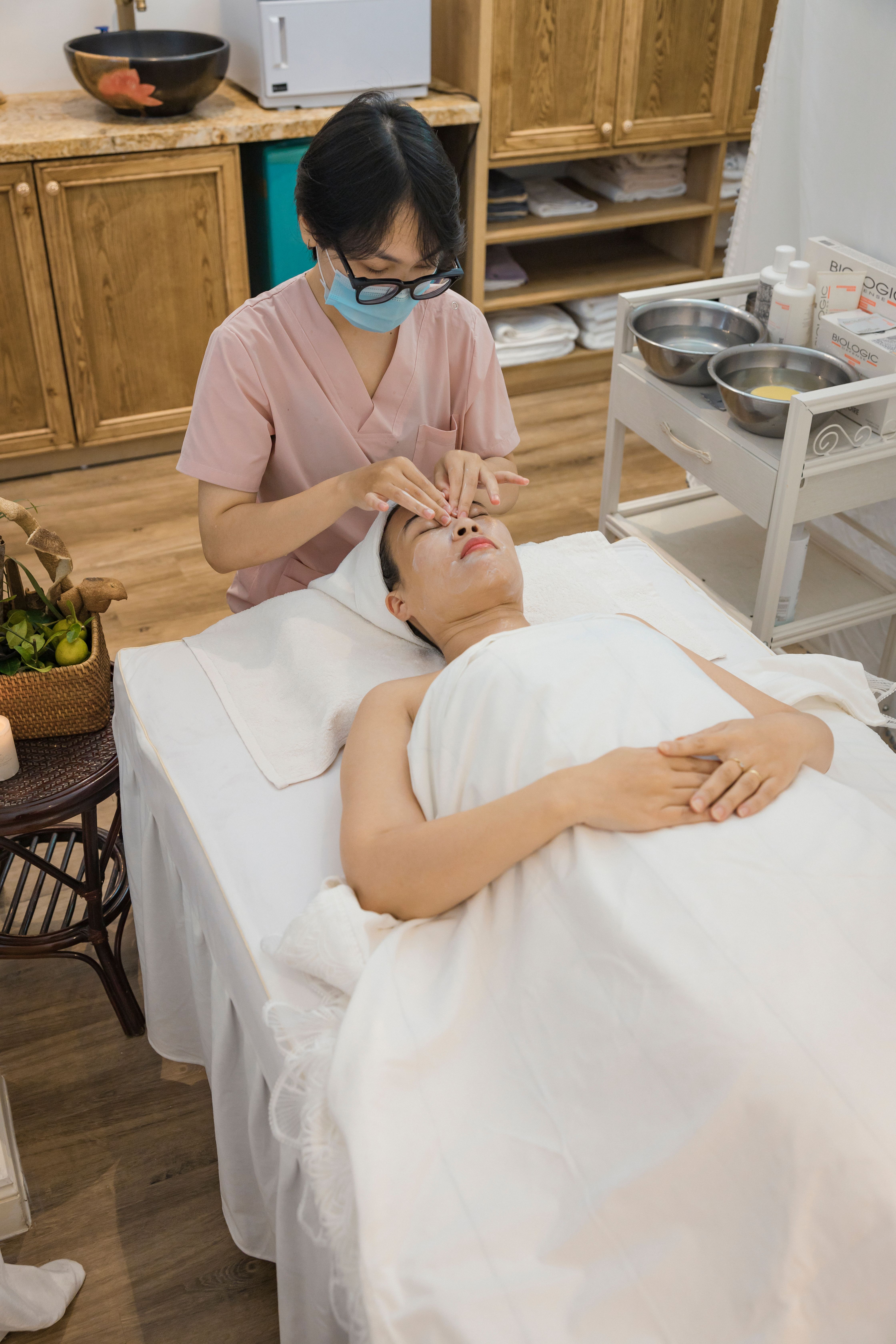 Aesthetician Doing a Facial Massage · Free Stock Photo