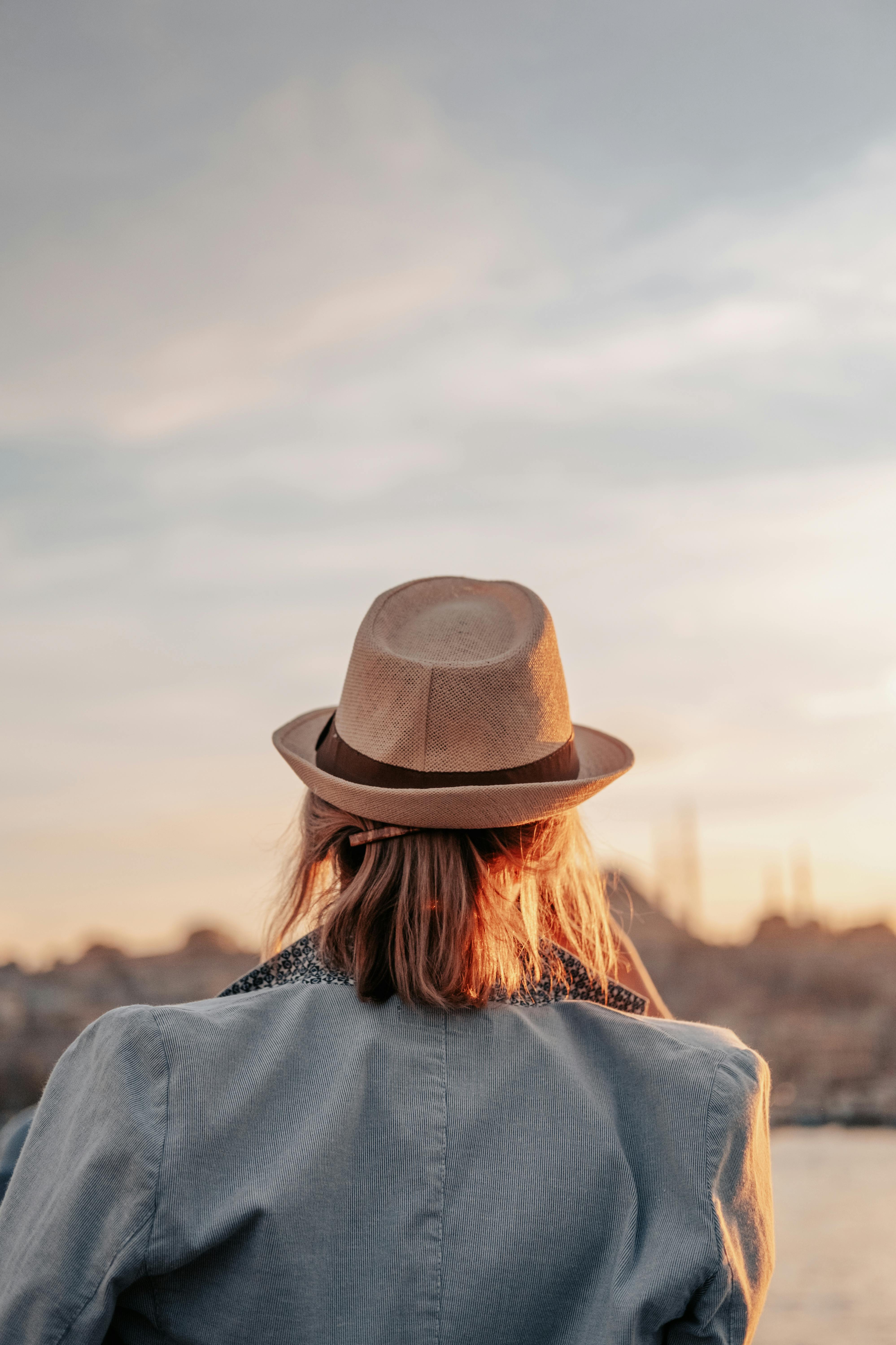 Person in Brown Fedora Hat and Gray Coat · Free Stock Photo
