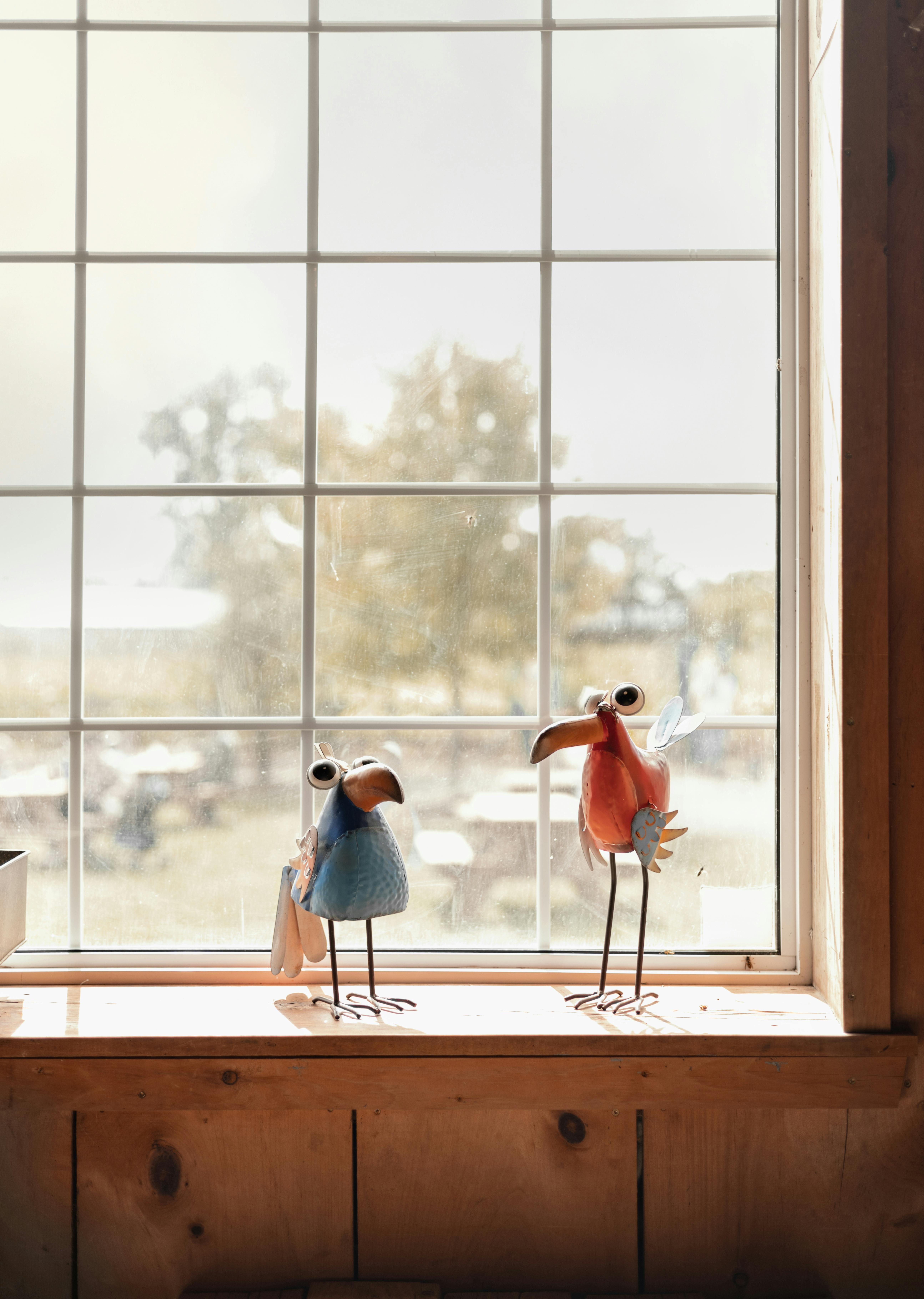 Cute Handmade Figurines of Birds Standing on a Windowsill · Free Stock ...