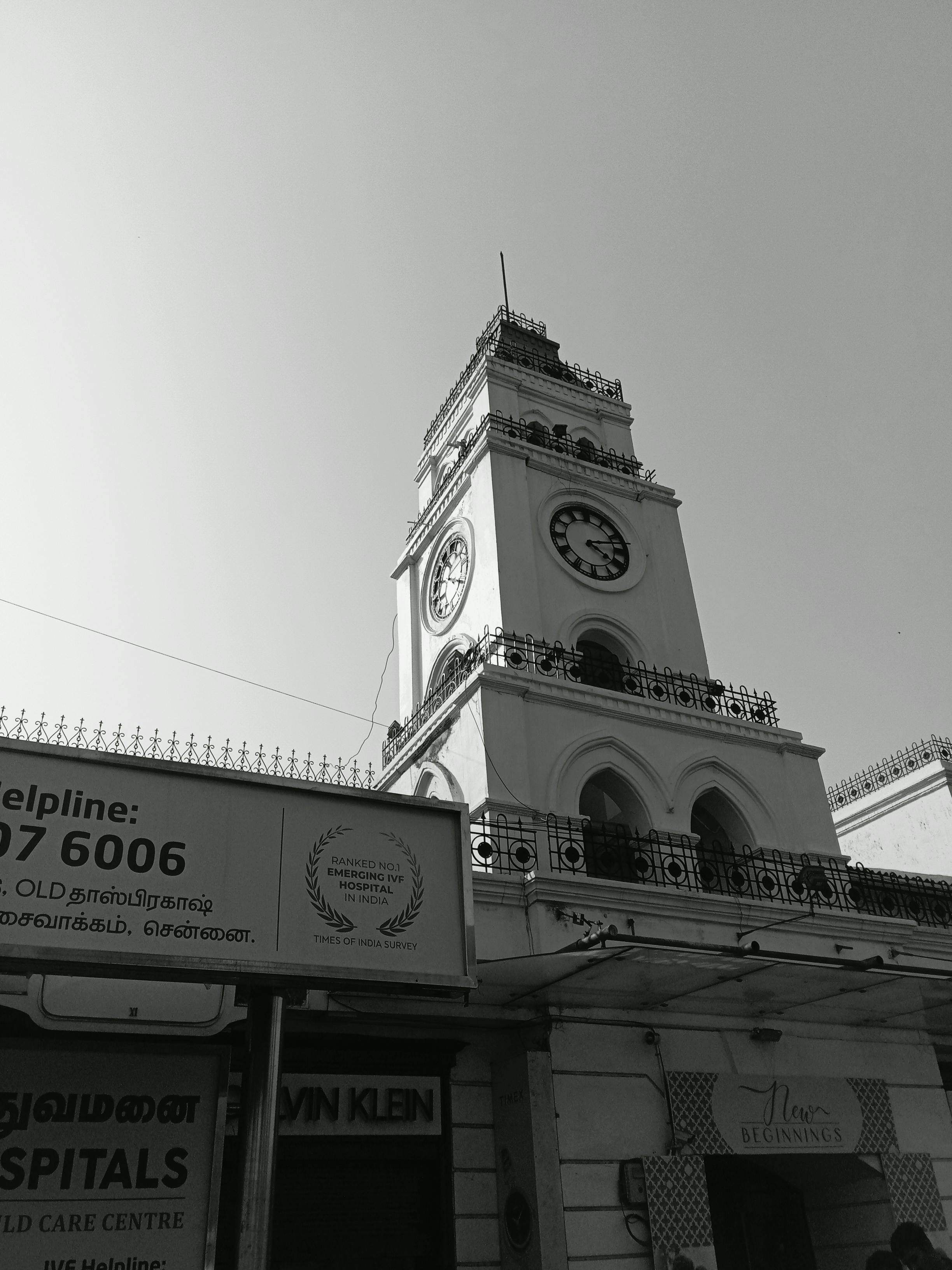 Grayscale Photo of a Clock Tower · Free Stock Photo