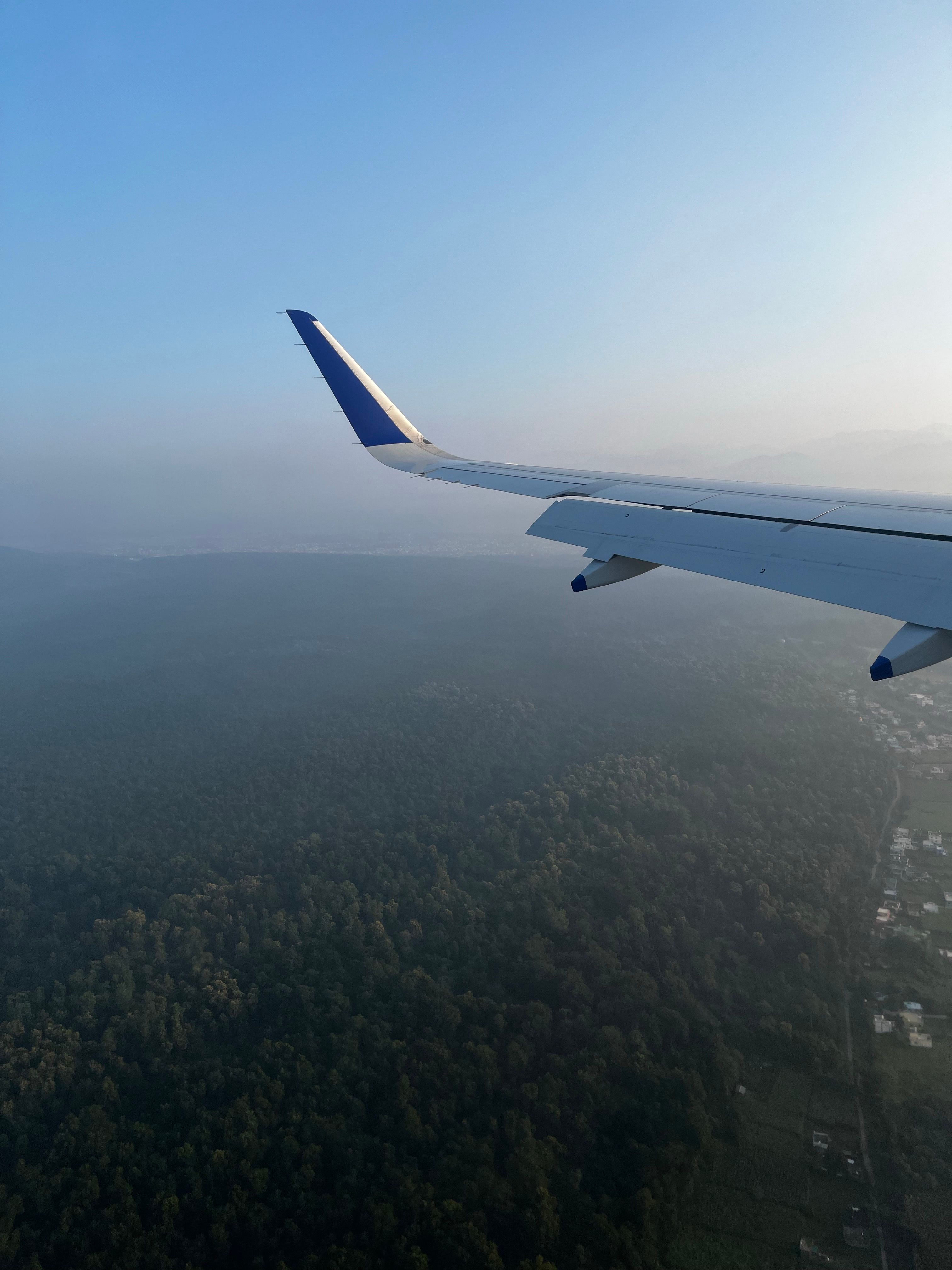 Passenger Airplane Flying over Mountains · Free Stock Photo