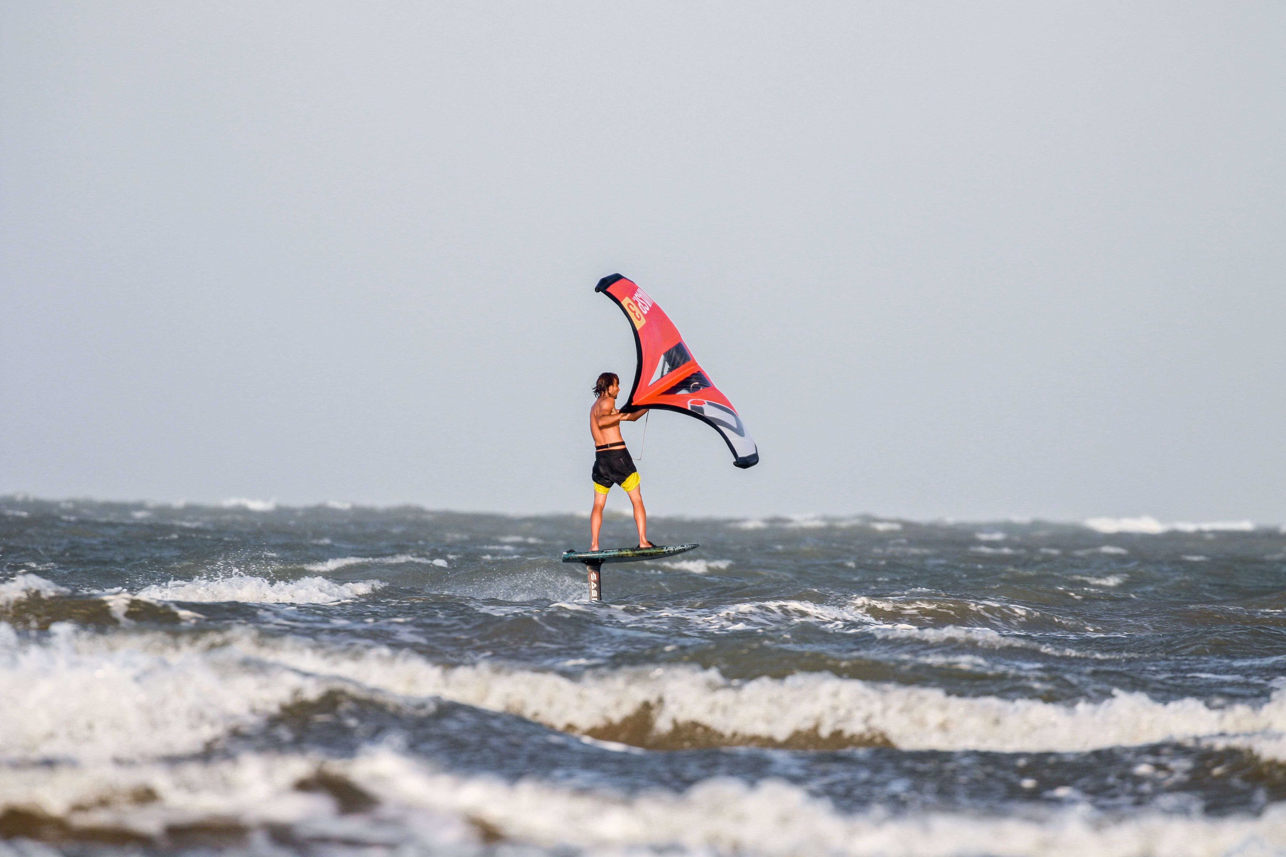 Man Kitesurfing on Sea Waves · Free Stock Photo