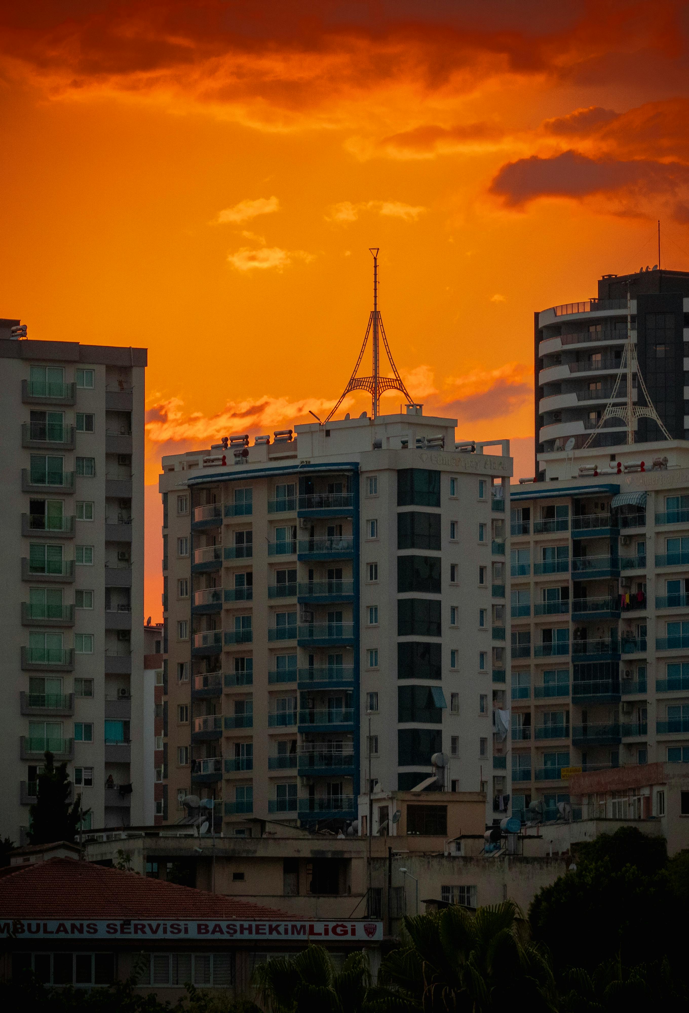 Dramatic Orange Sunset above Residential Buildings · Free Stock Photo