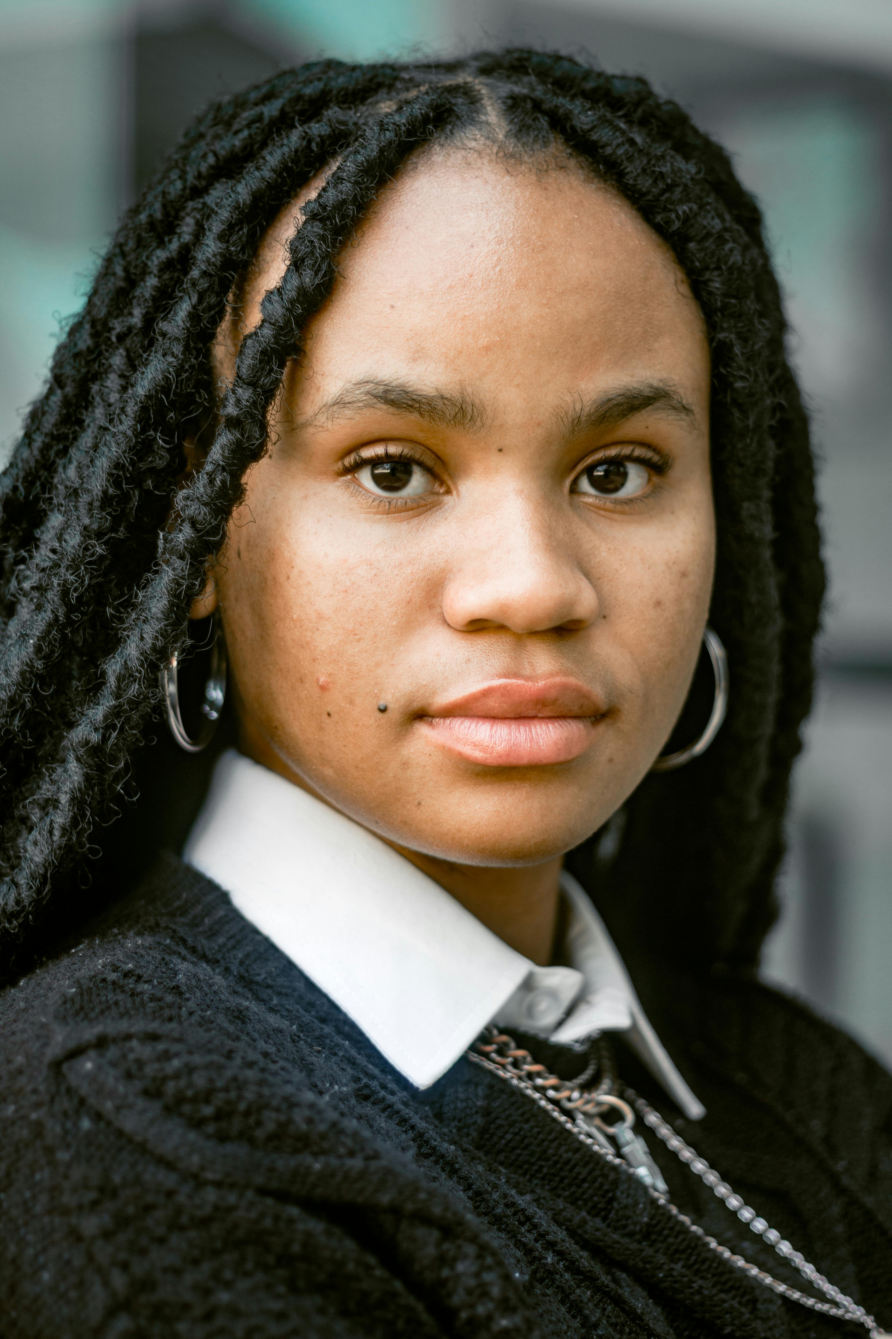 Close-Up Shot of a Woman with Dreadlock Hairstyle · Free Stock Photo