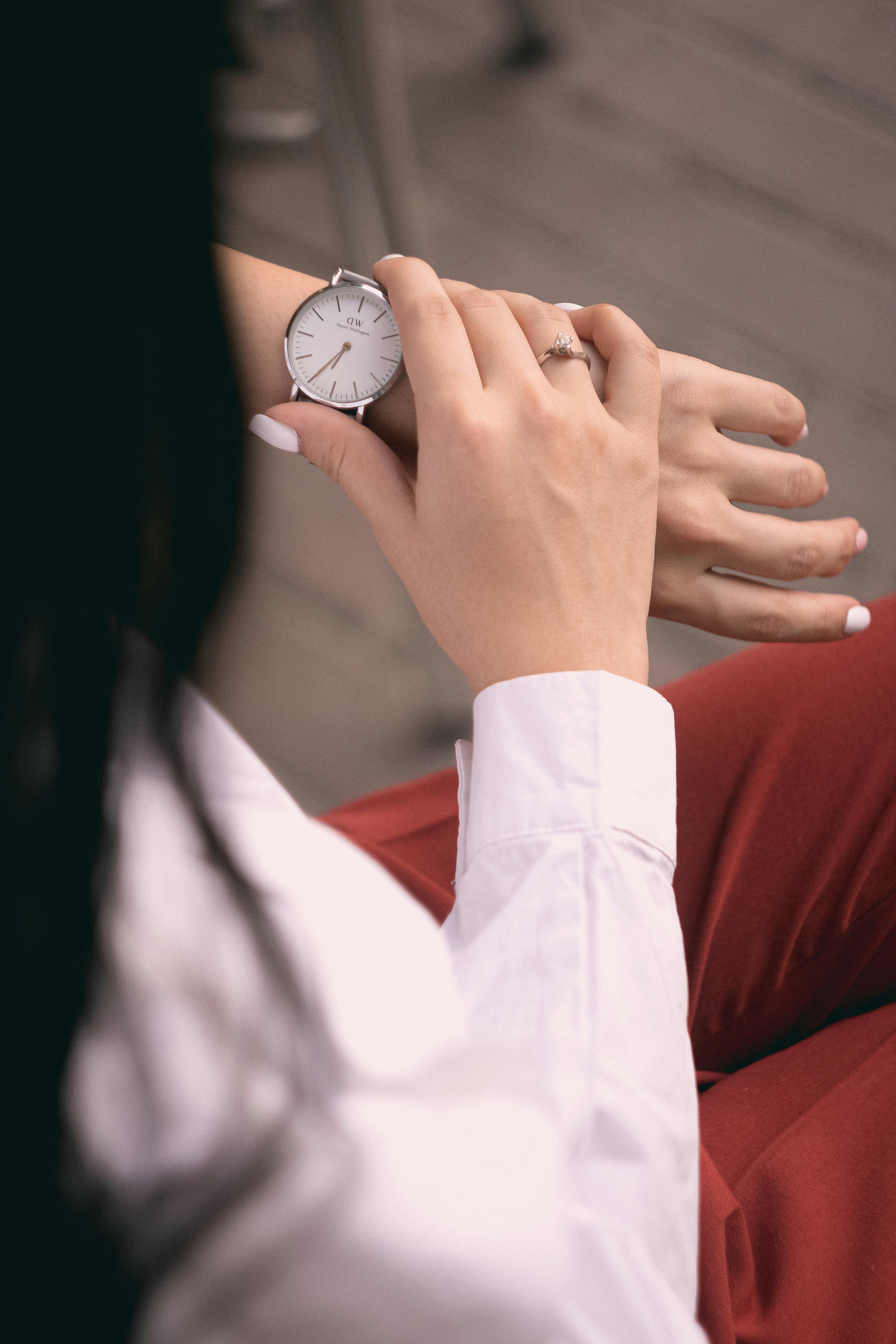Woman Looking at her Watch · Free Stock Photo