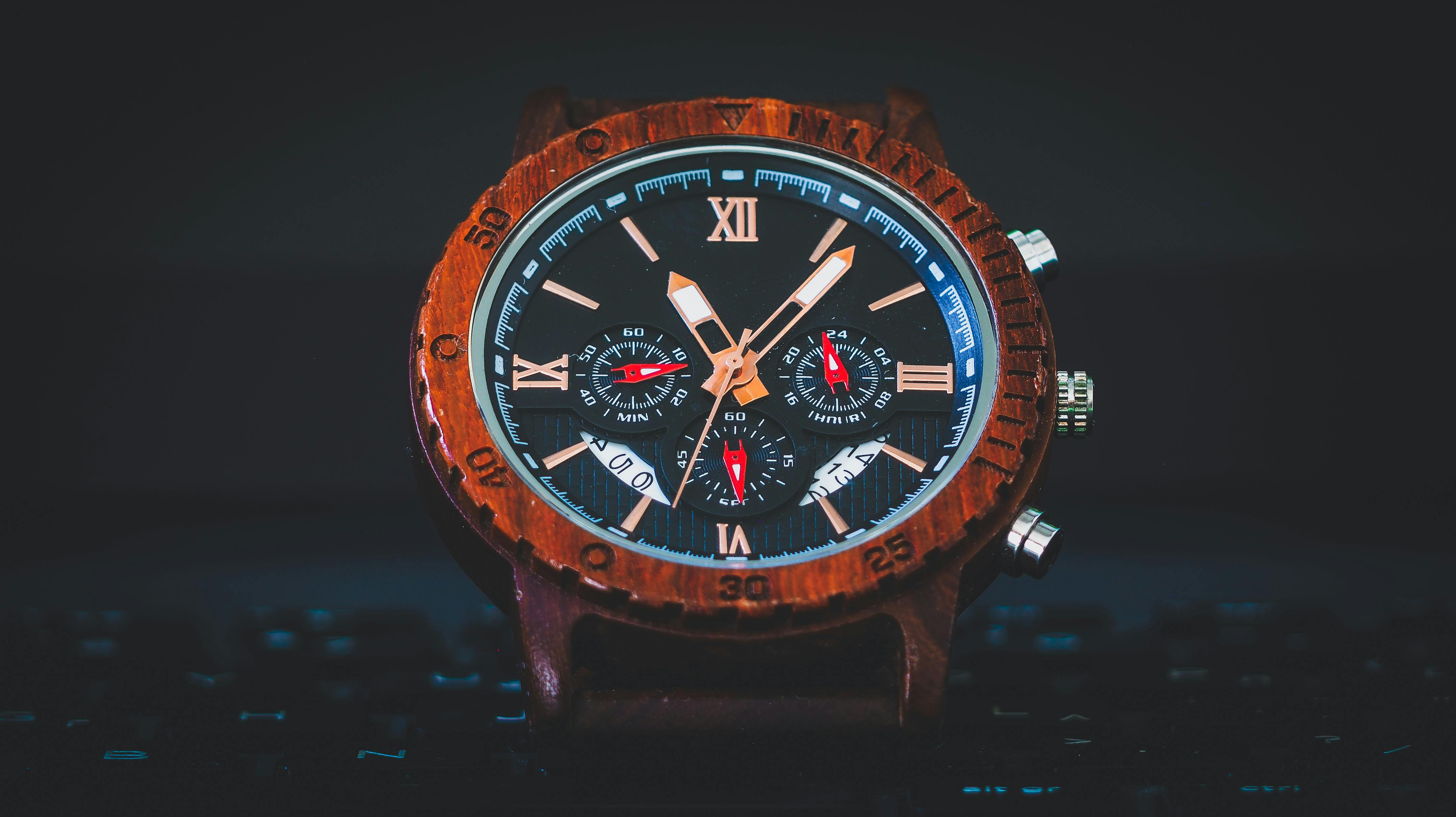 A Brown and Black Chronograph Watch in Close-up Shot · Free Stock Photo
