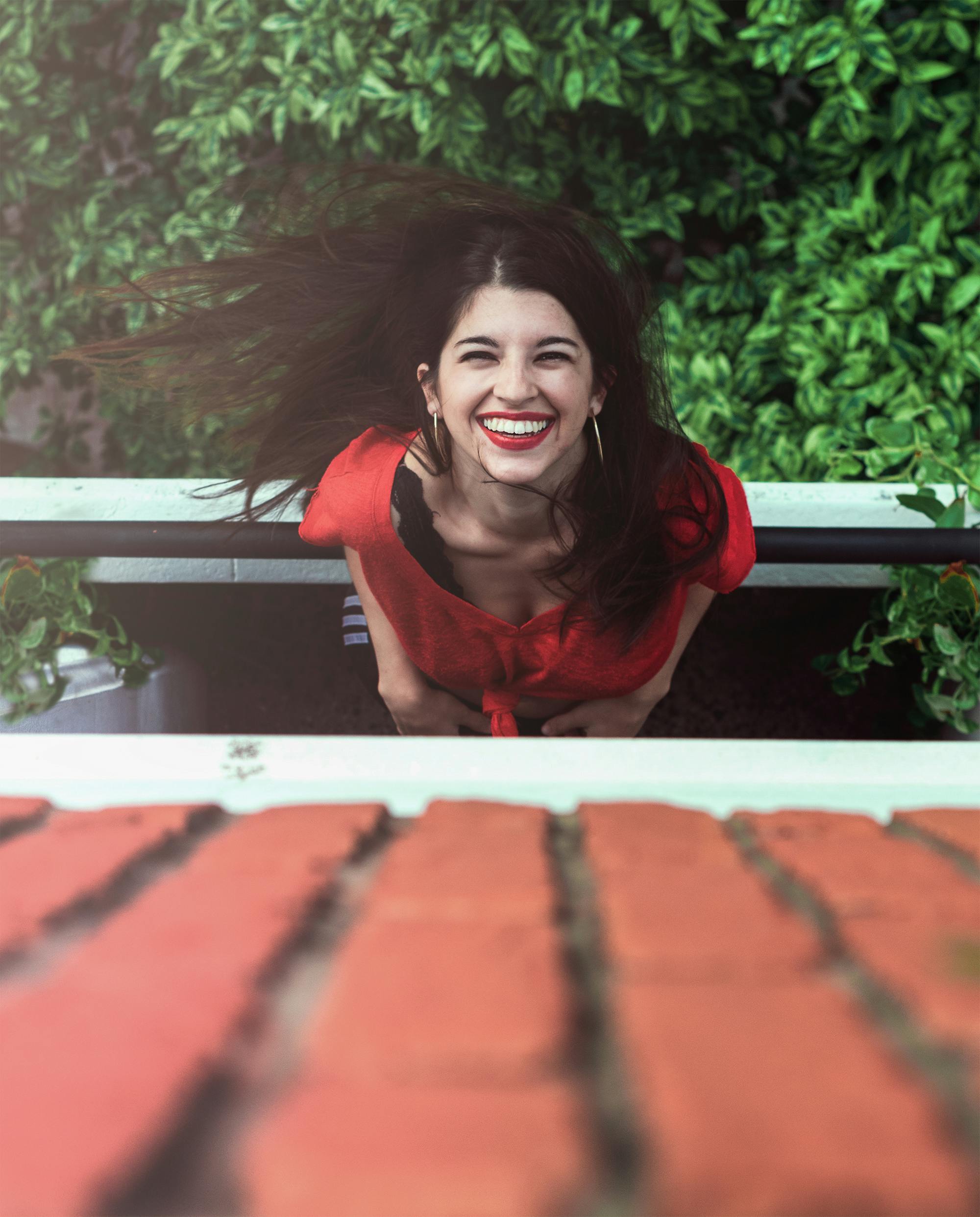 Woman in Red Top Smiling · Free Stock Photo
