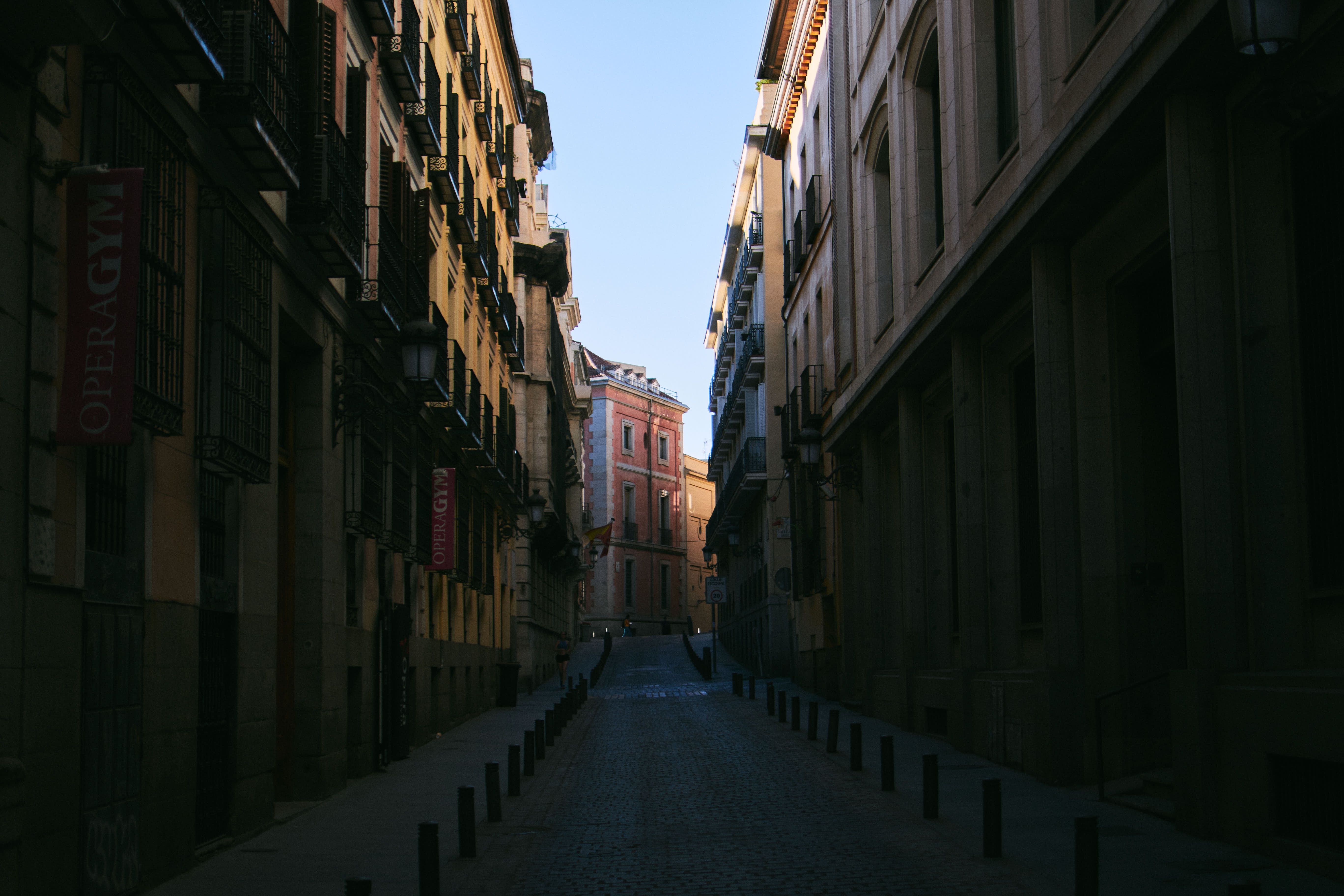 Sidewalk and Buildings in City Alley · Free Stock Photo