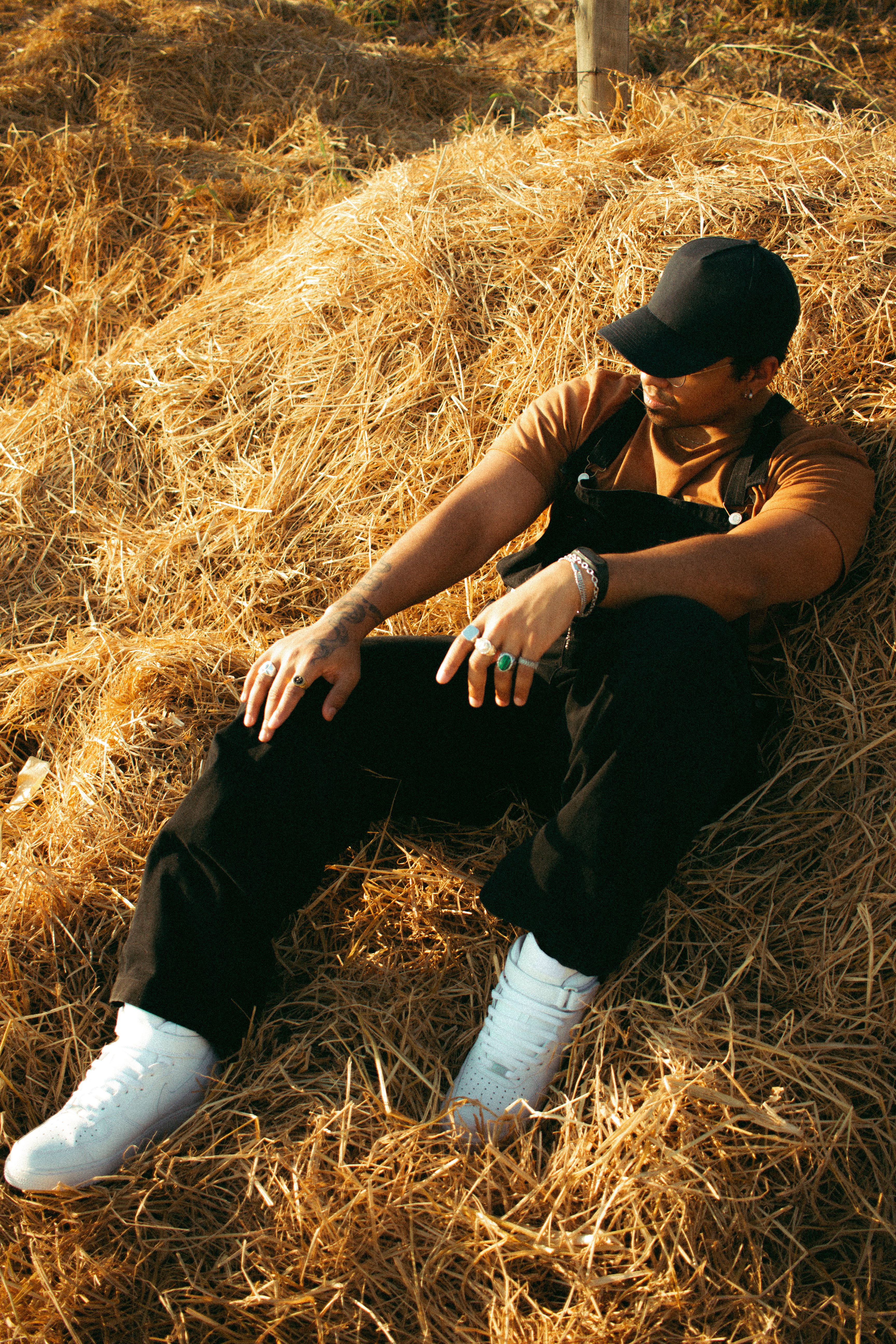 Man Sitting on Hay · Free Stock Photo