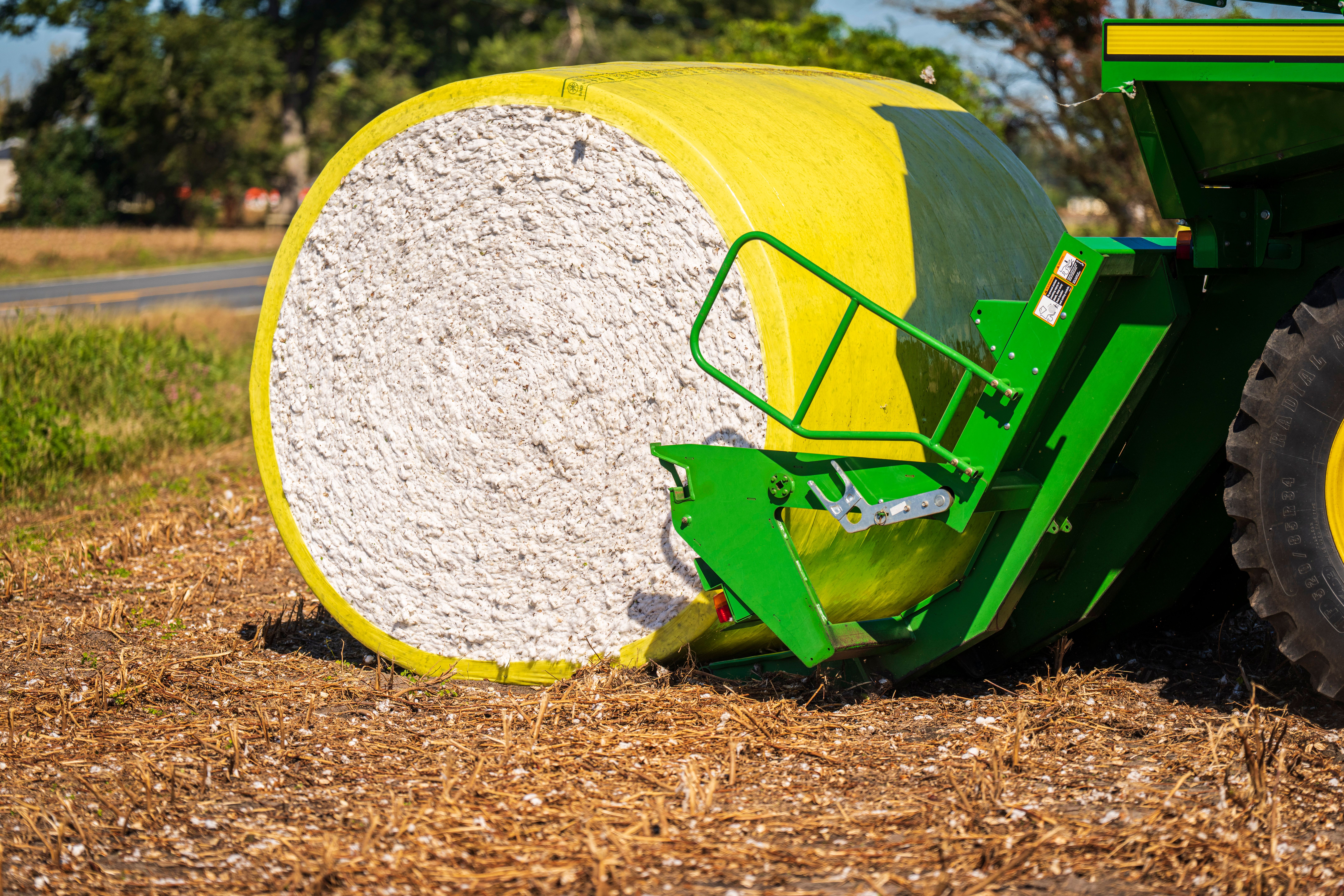 Cotton Bale on Green Tractor · Free Stock Photo