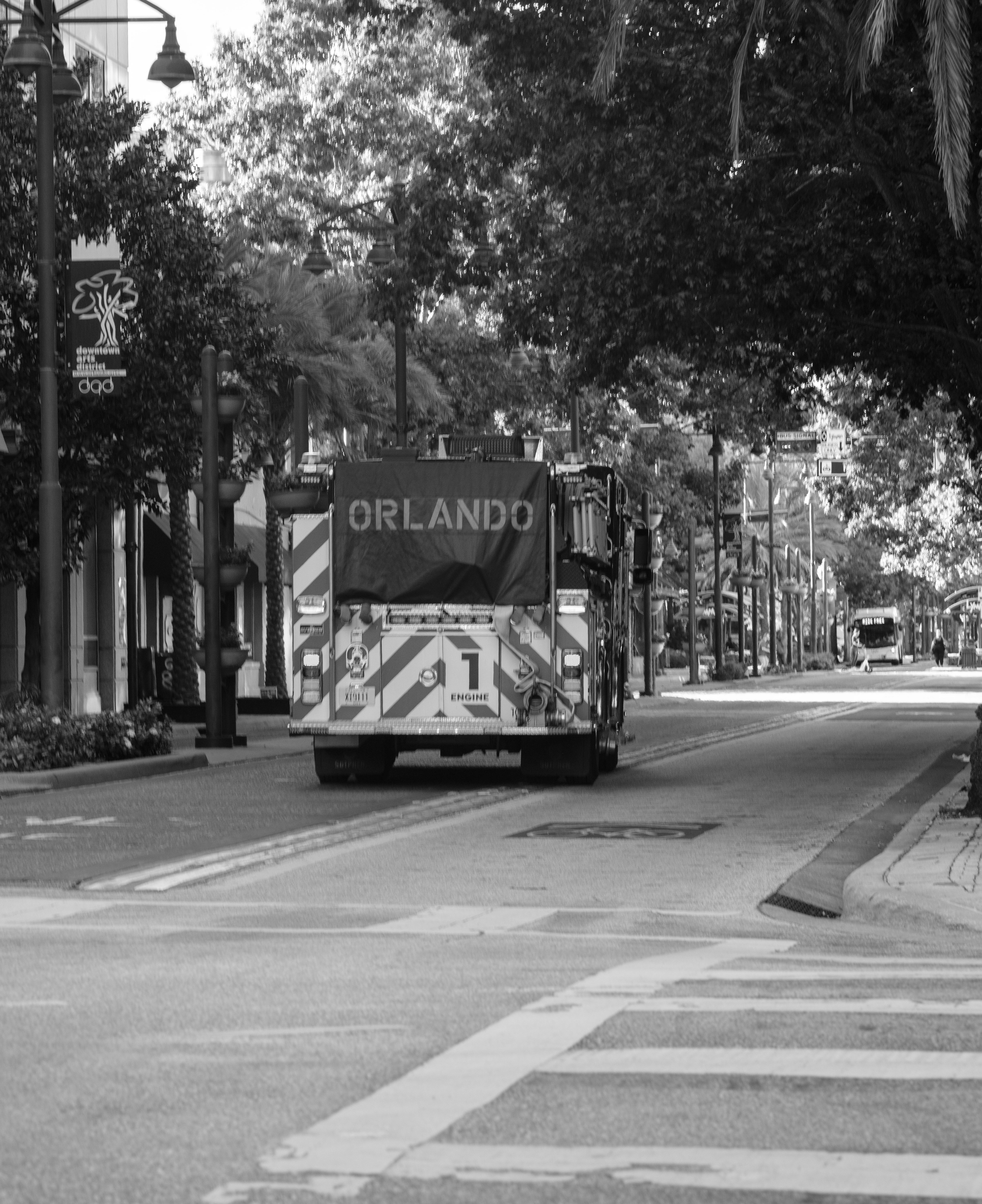 Grayscale Photo of a Fire Truck on Road · Free Stock Photo