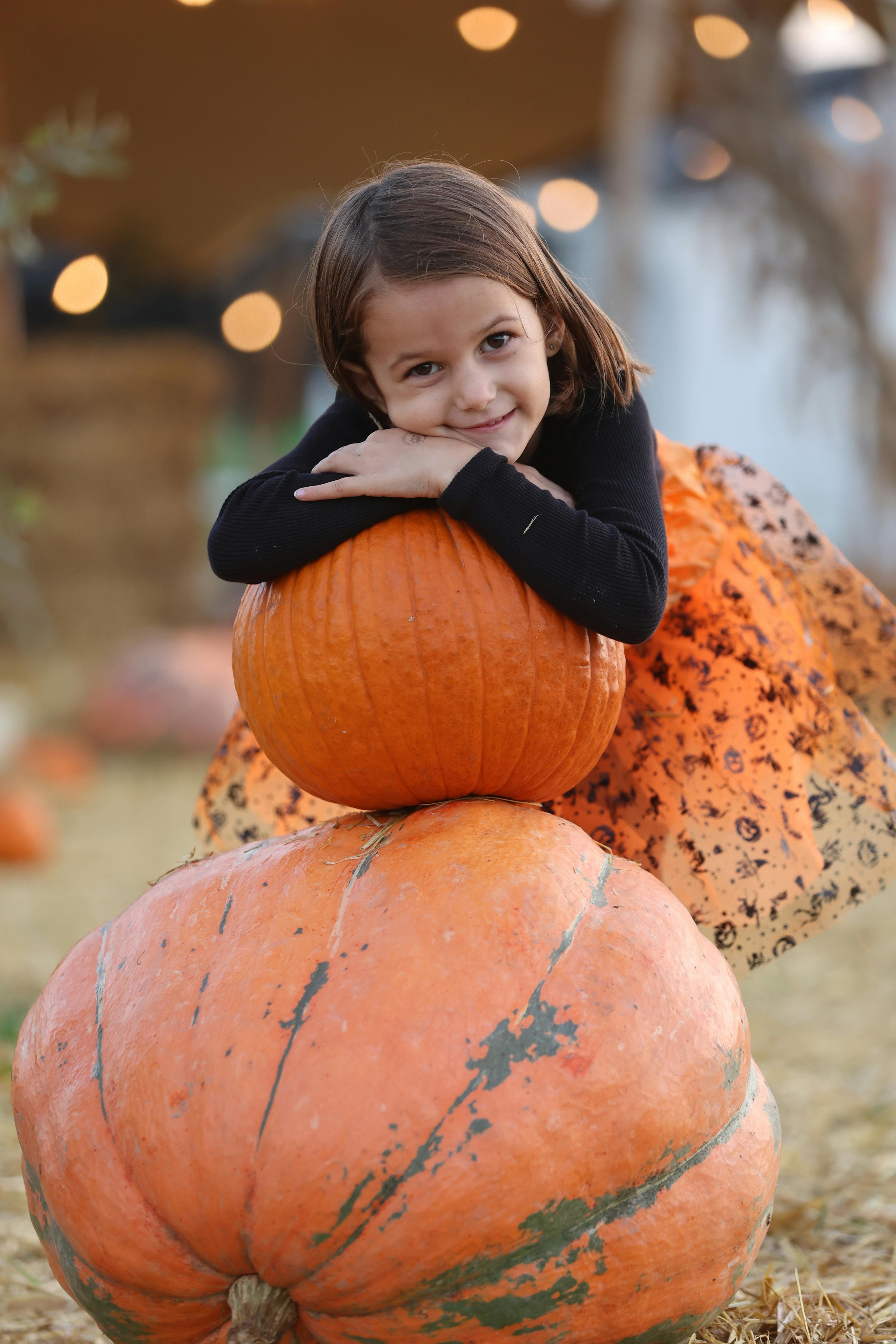A Girl with Pumpkins · Free Stock Photo