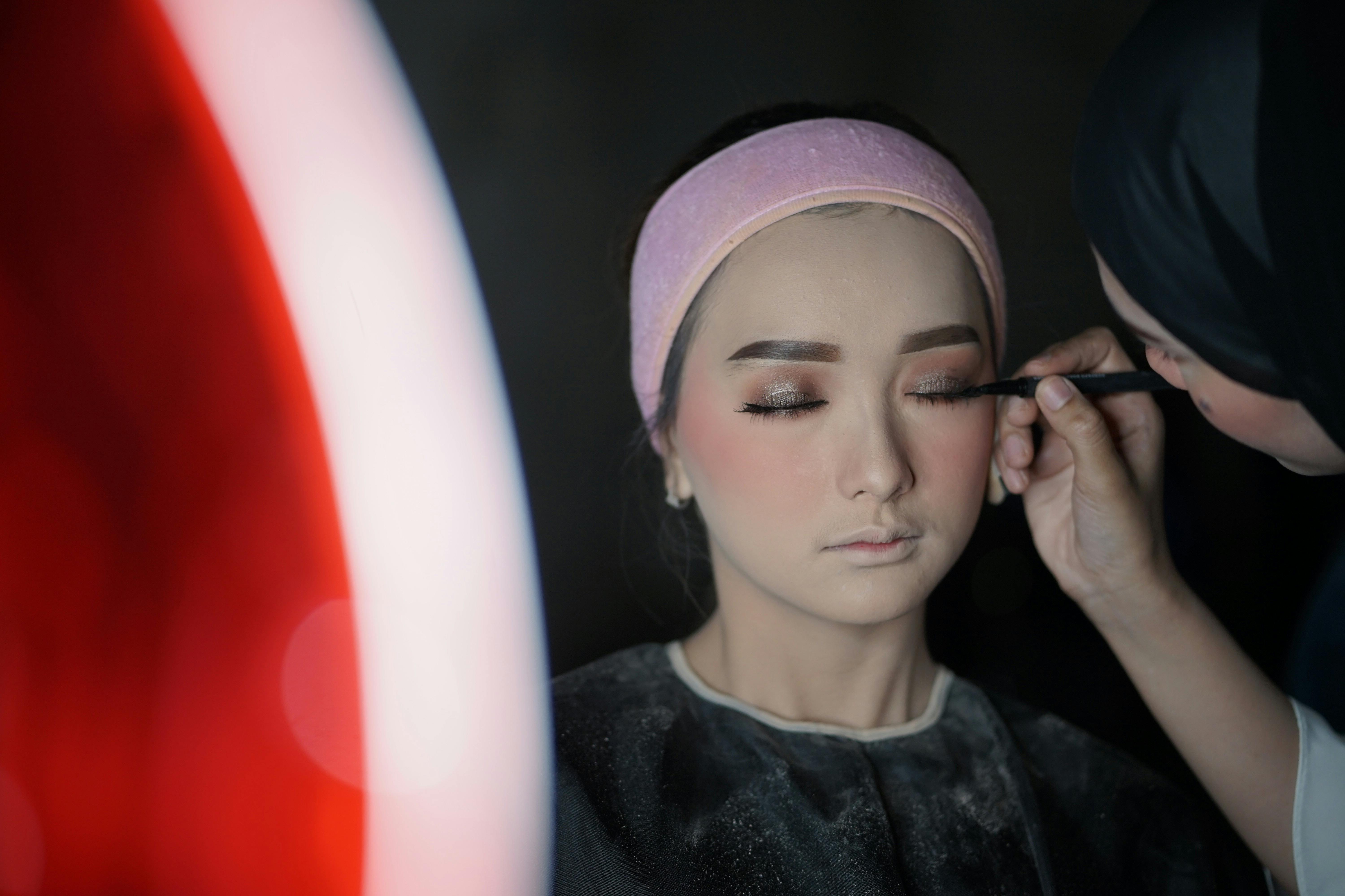 A Woman Having a Makeup Service · Free Stock Photo