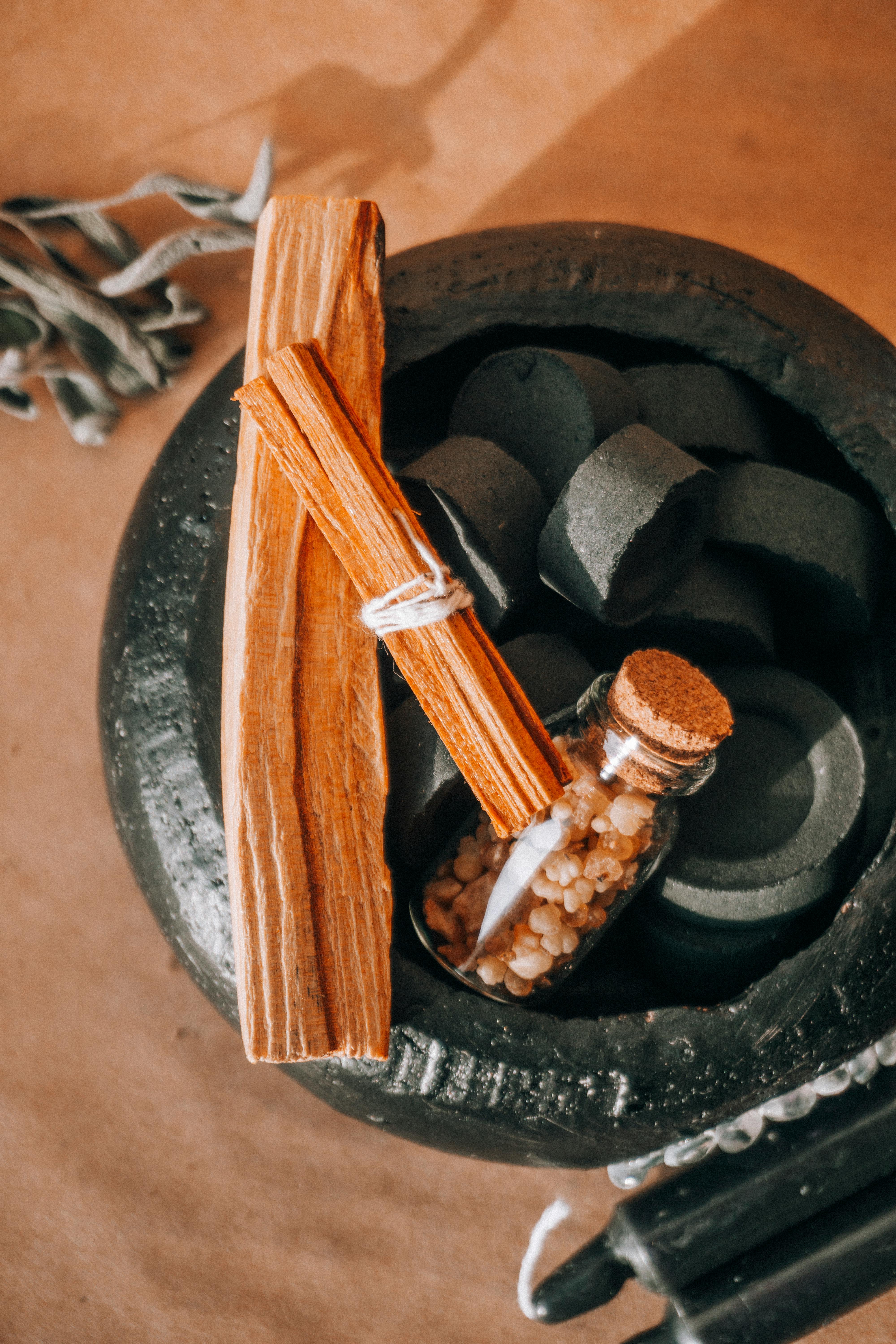 Candles and Scented Wood in a Black Bowl · Free Stock Photo