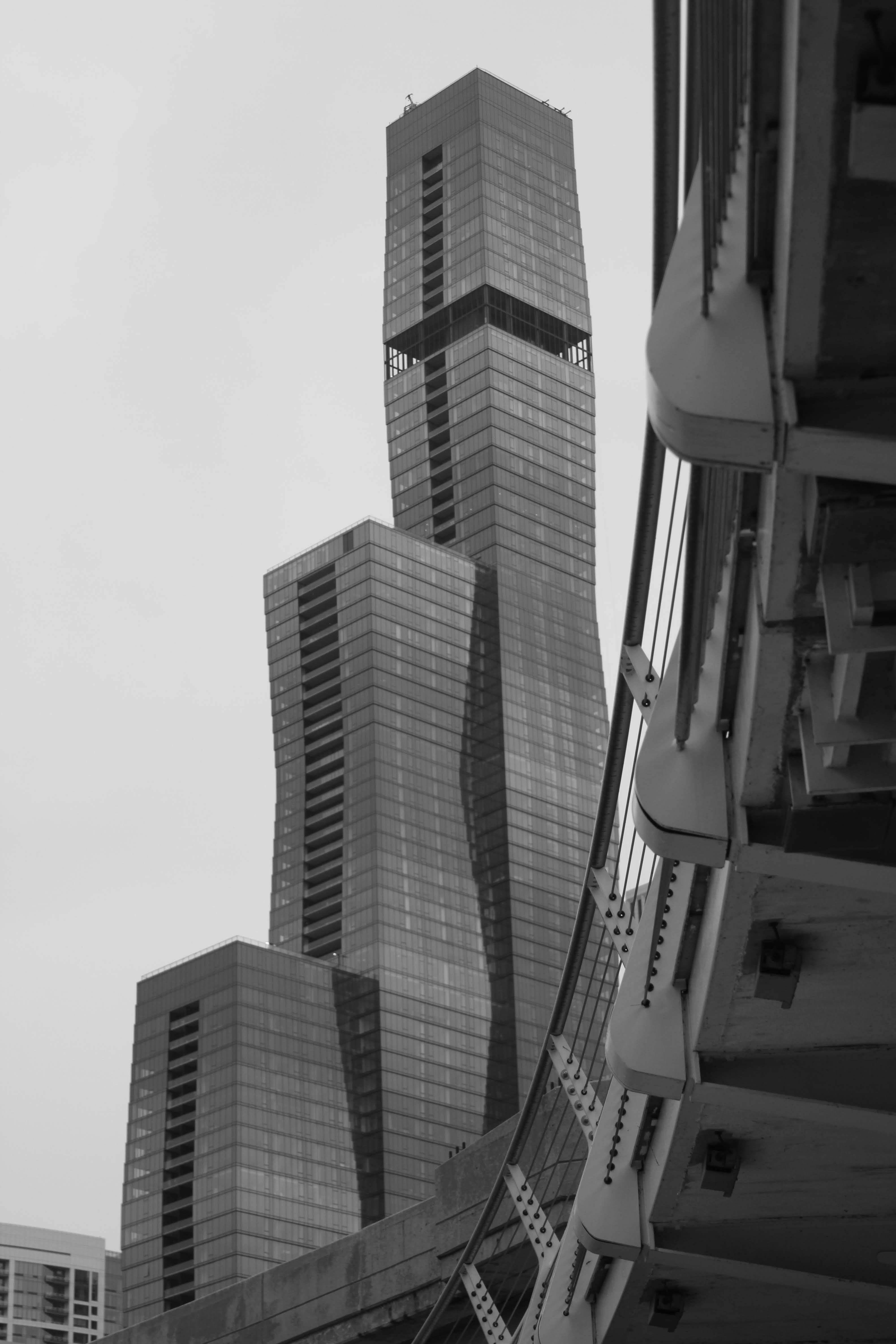 A Grayscale Photo of a High Rise Building · Free Stock Photo