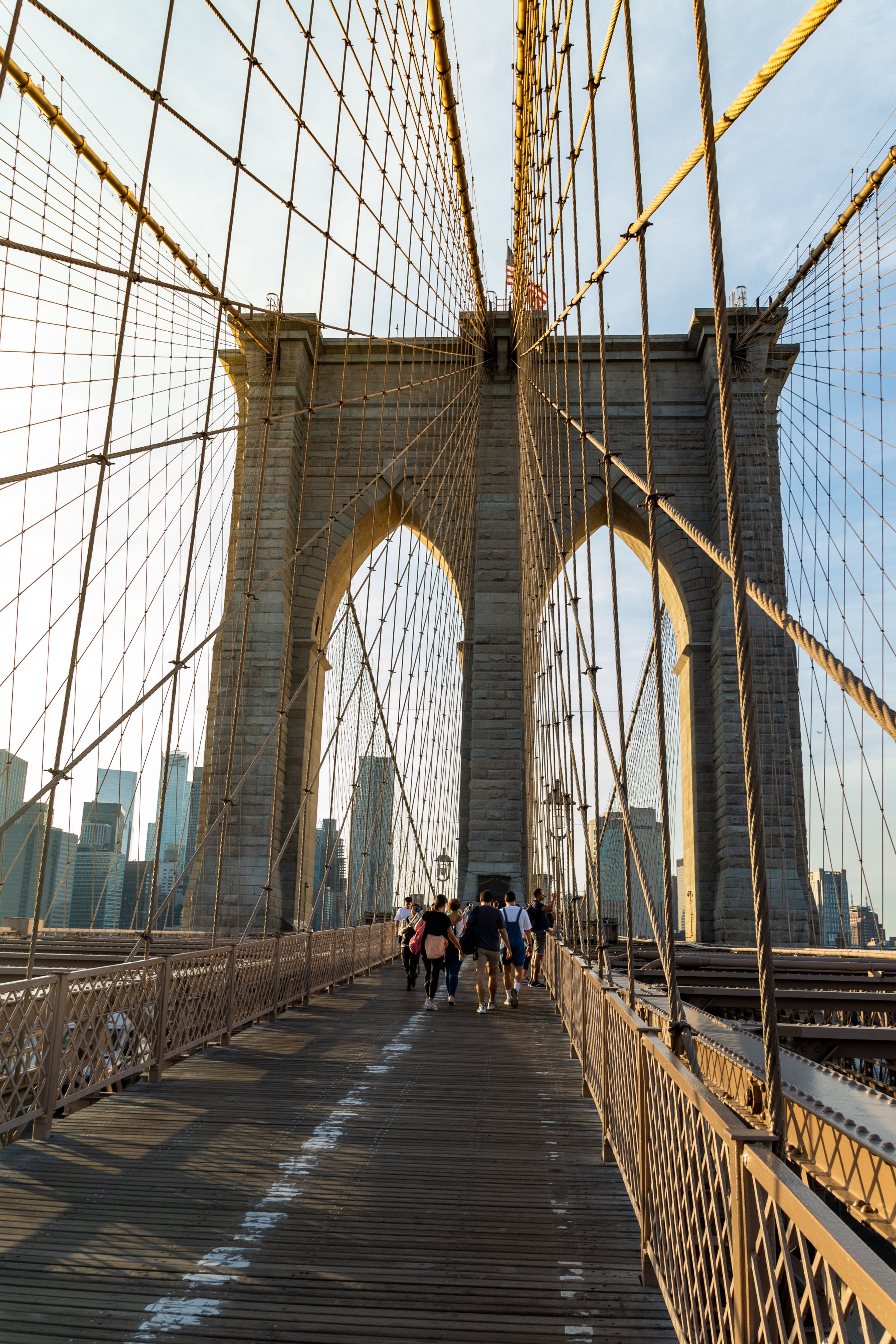 People Walking Along a Footpath of the Brooklyn Bridge · Free Stock Photo
