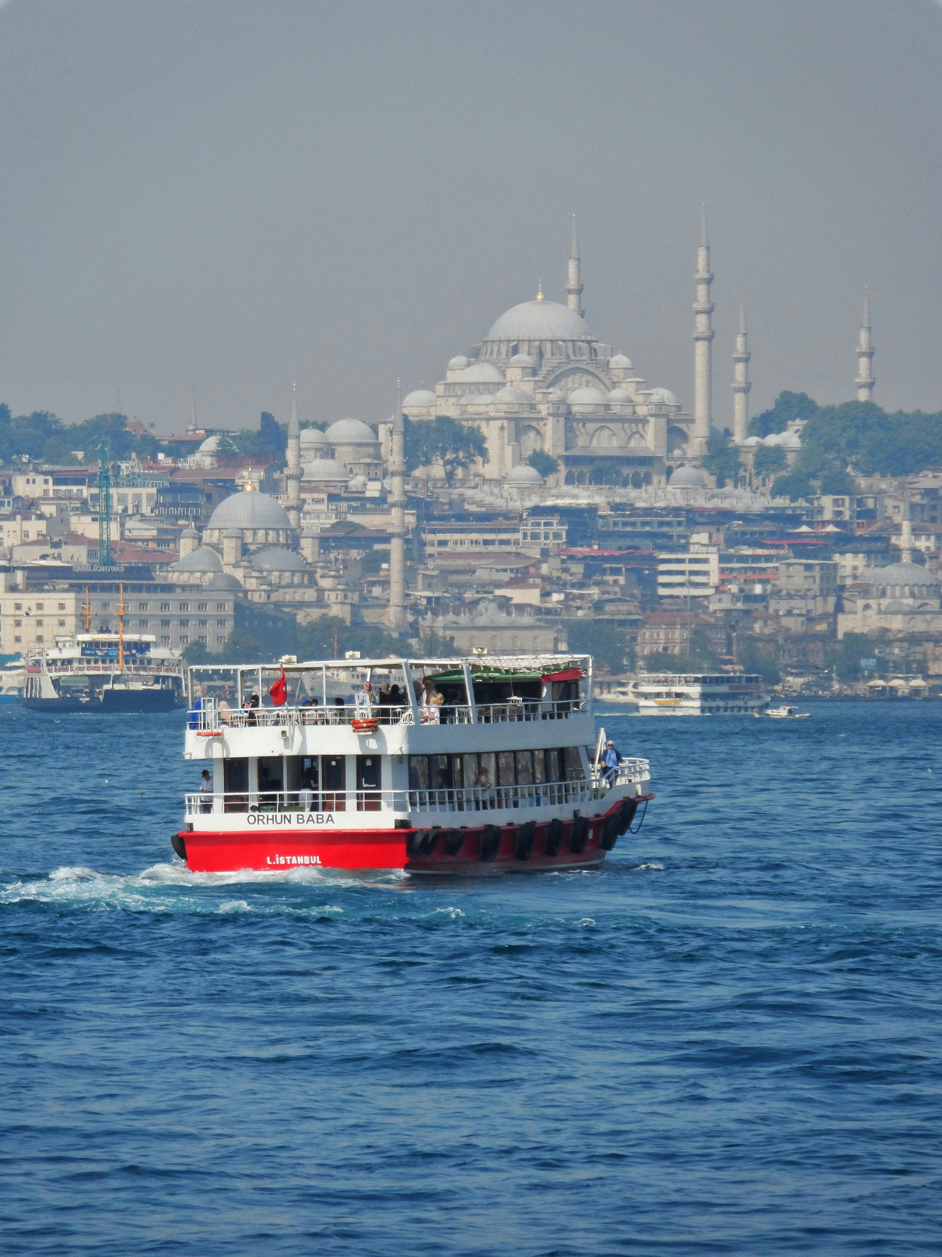 White and Red Ferry Boat on Sea · Free Stock Photo