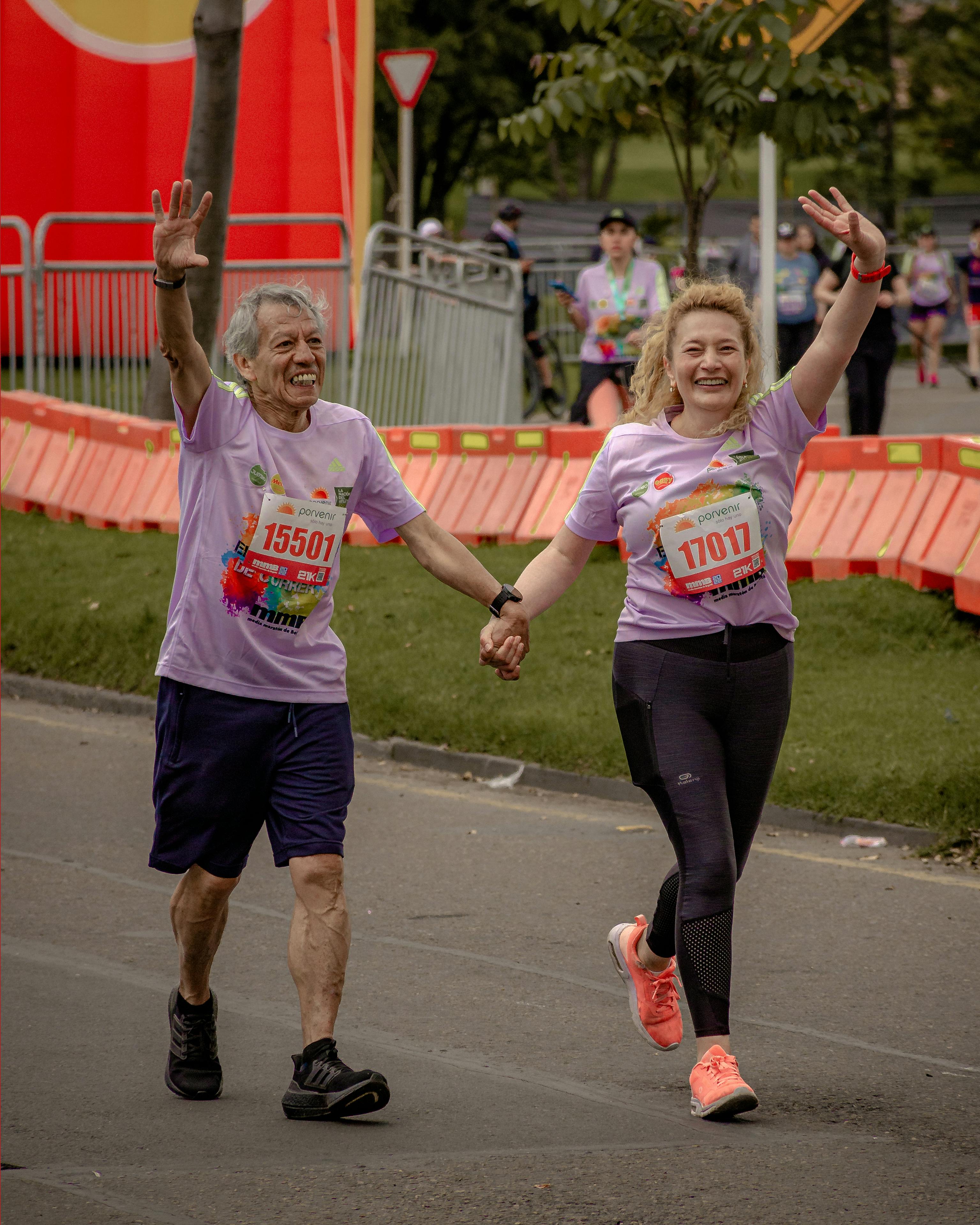 Runners Waving their Hands and Smiling · Free Stock Photo