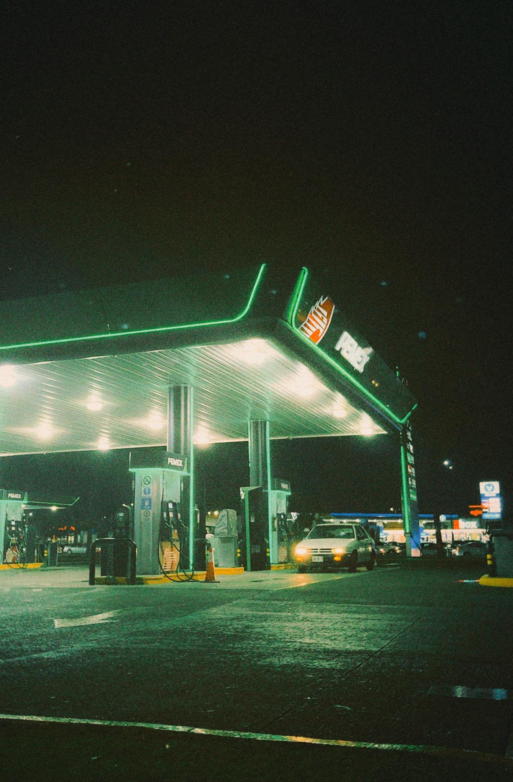 White Car Filling Gas on a Station During Night Time · Free Stock Photo