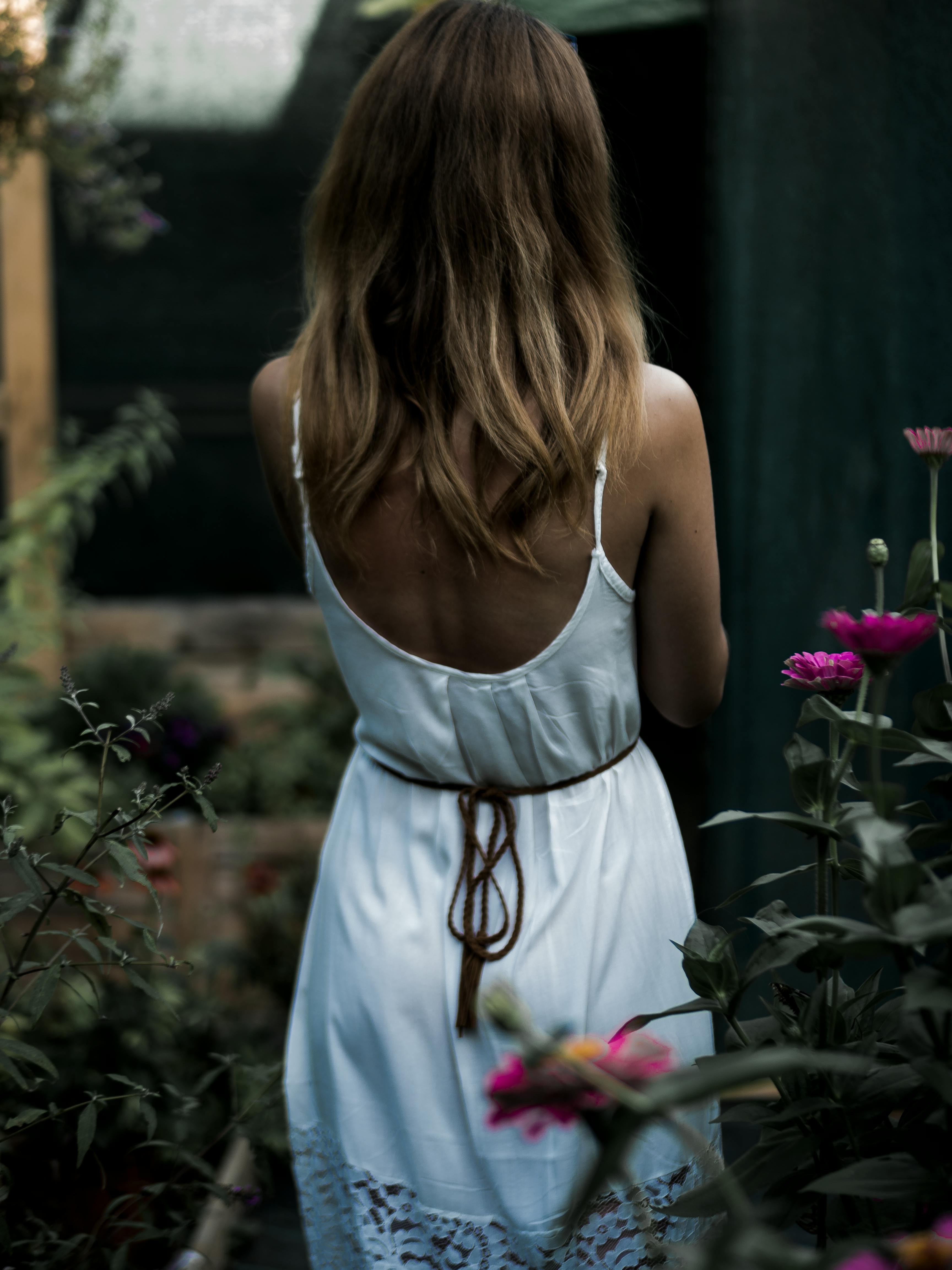 Back View of a Woman Wearing White Dress · Free Stock Photo