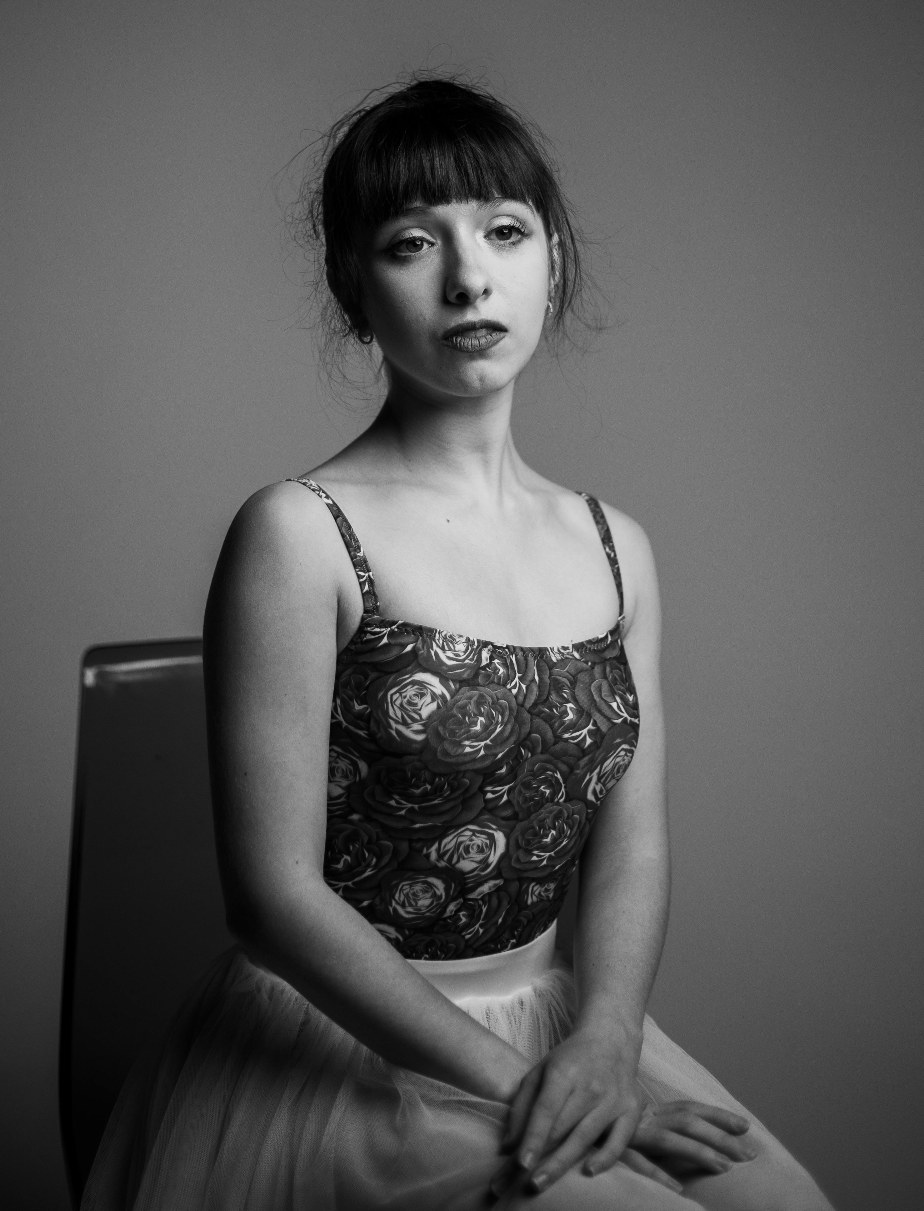 Woman Sitting Astride a Chair · Free Stock Photo