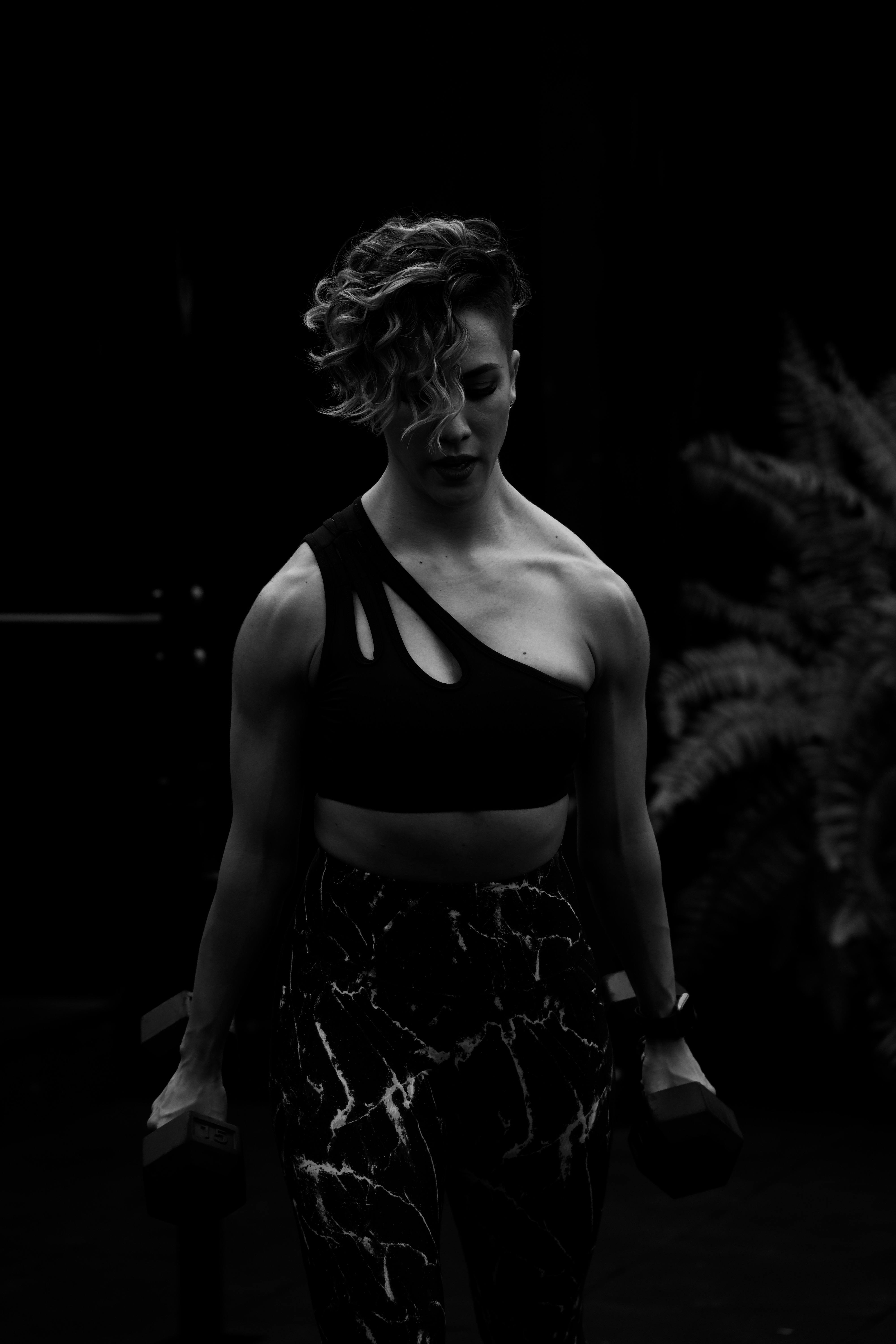 Grayscale Photo of Woman Wearing Baseball Uniform · Free Stock Photo