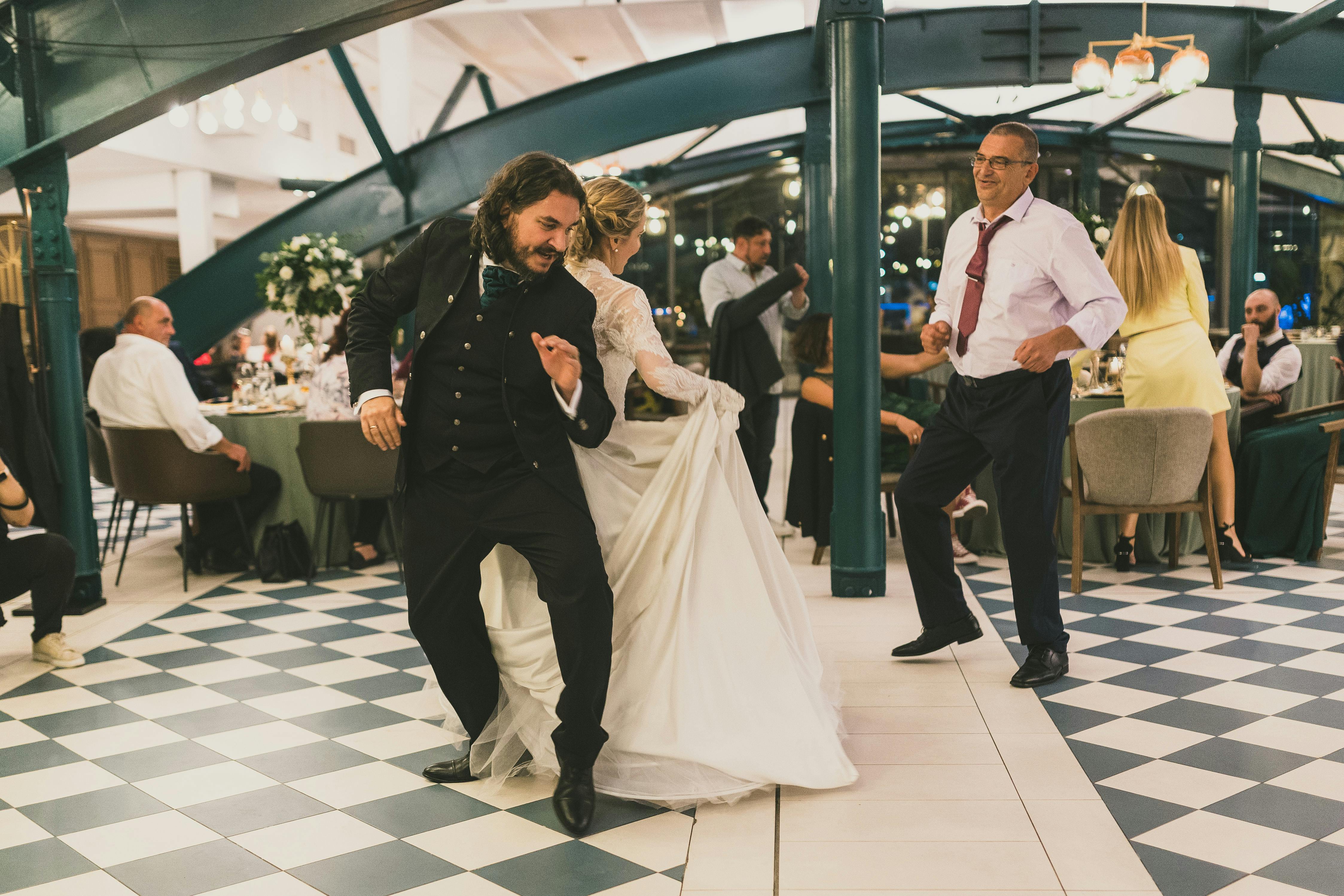 Bride and Groom Dancing Back to Back · Free Stock Photo