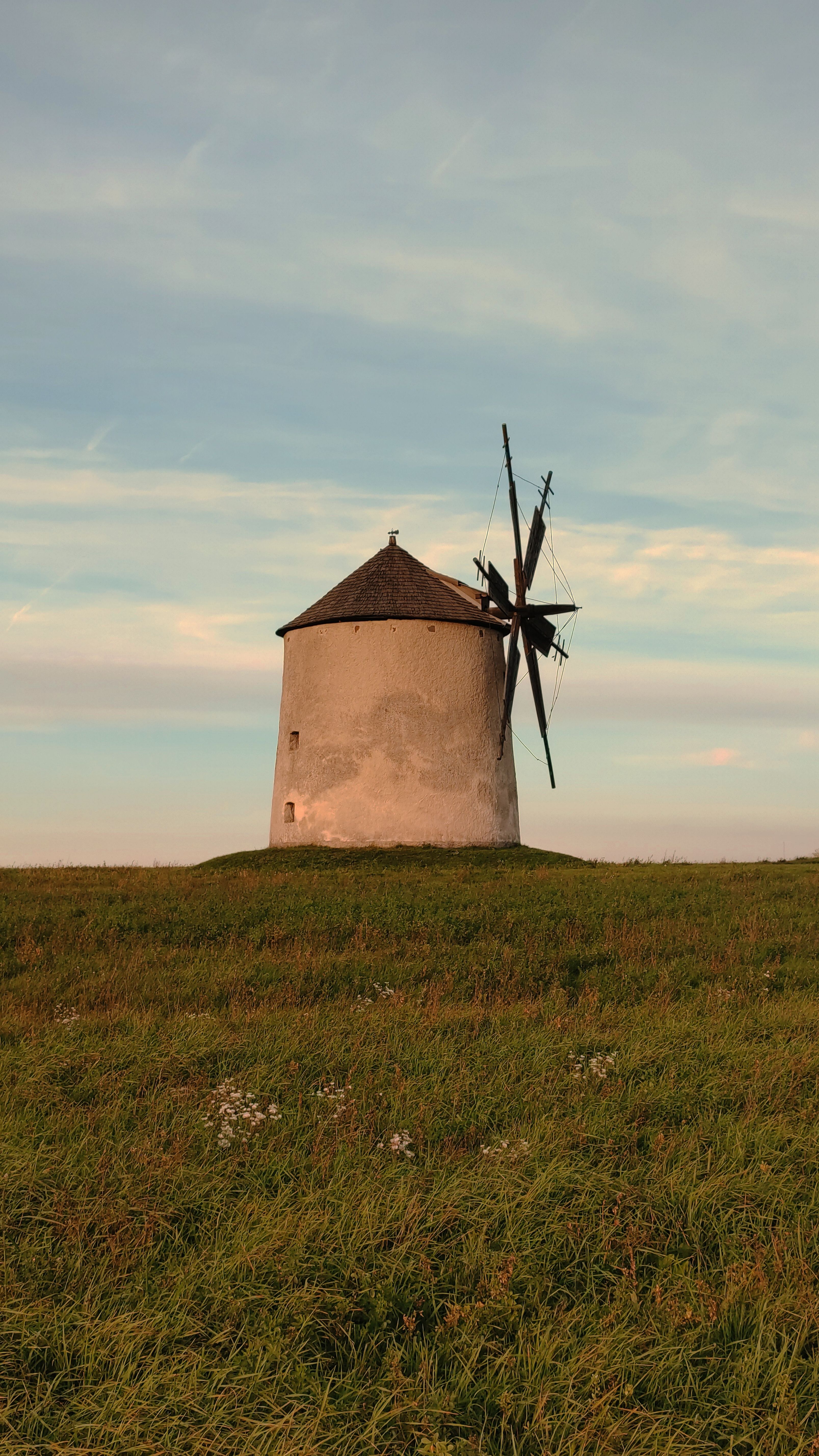 Brown Windmill on Grass Field Under the White Clouds · Free Stock Photo