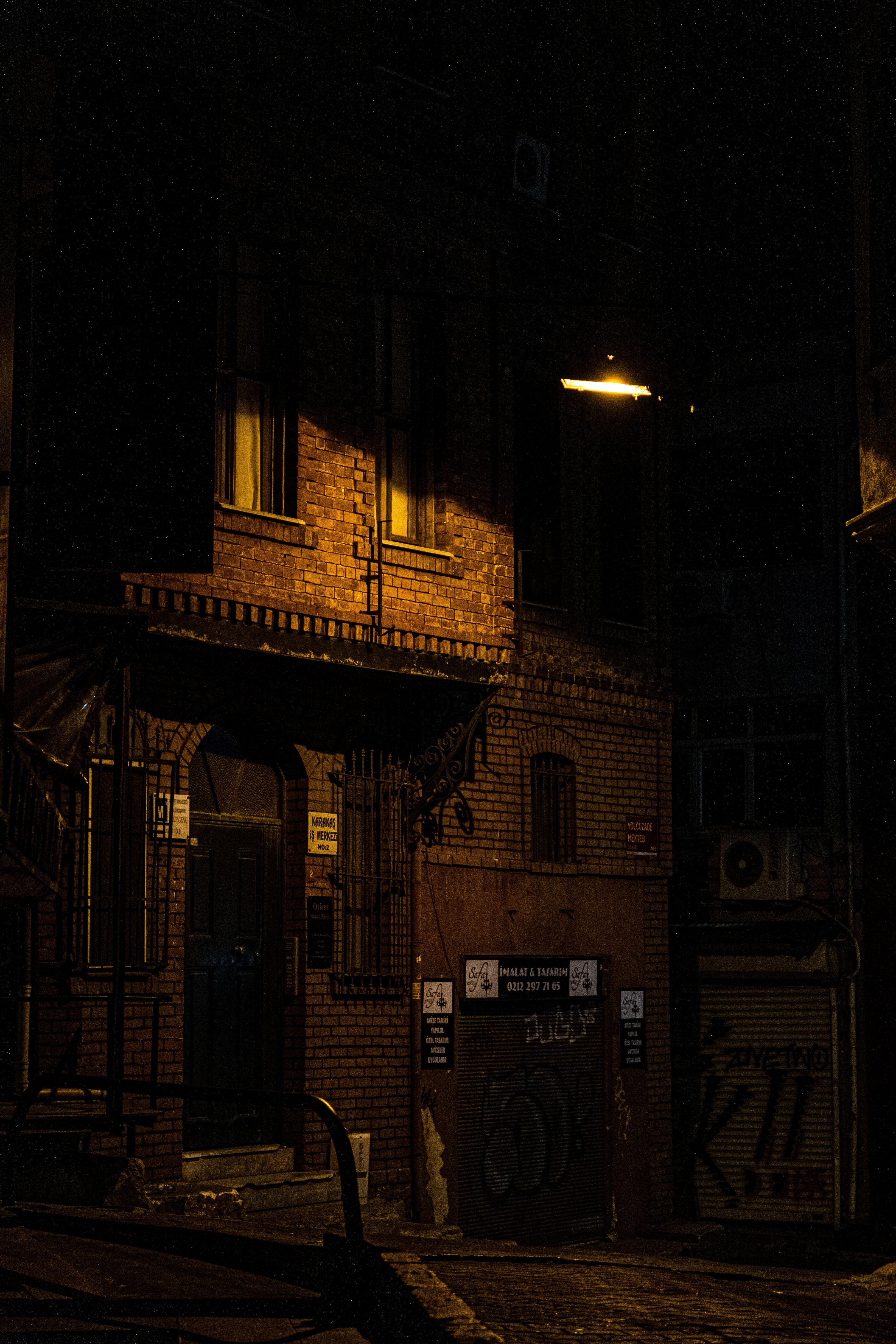 Brown Brick Building during Night Time · Free Stock Photo