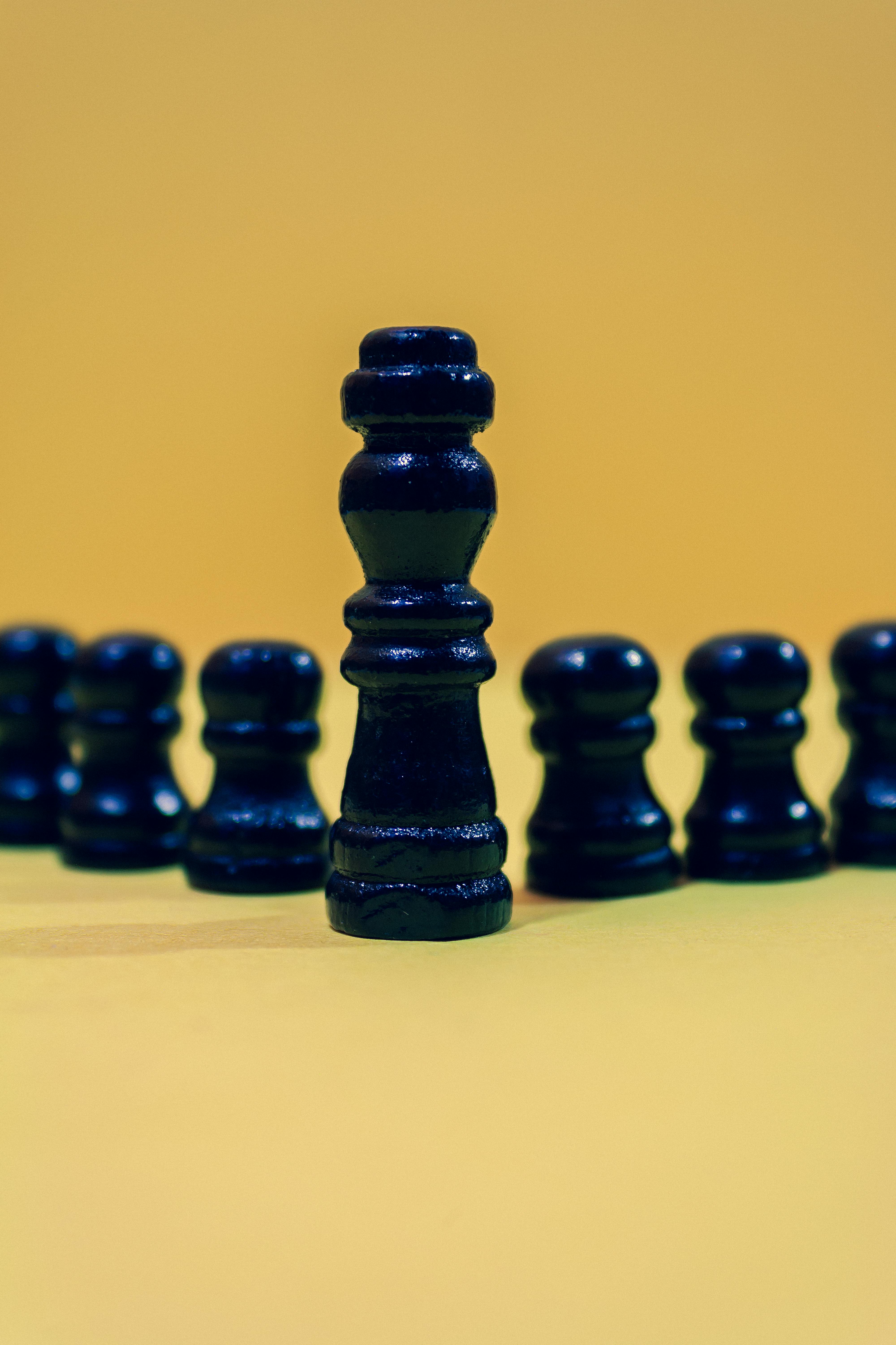 Chess Pieces on Yellow Background · Free Stock Photo