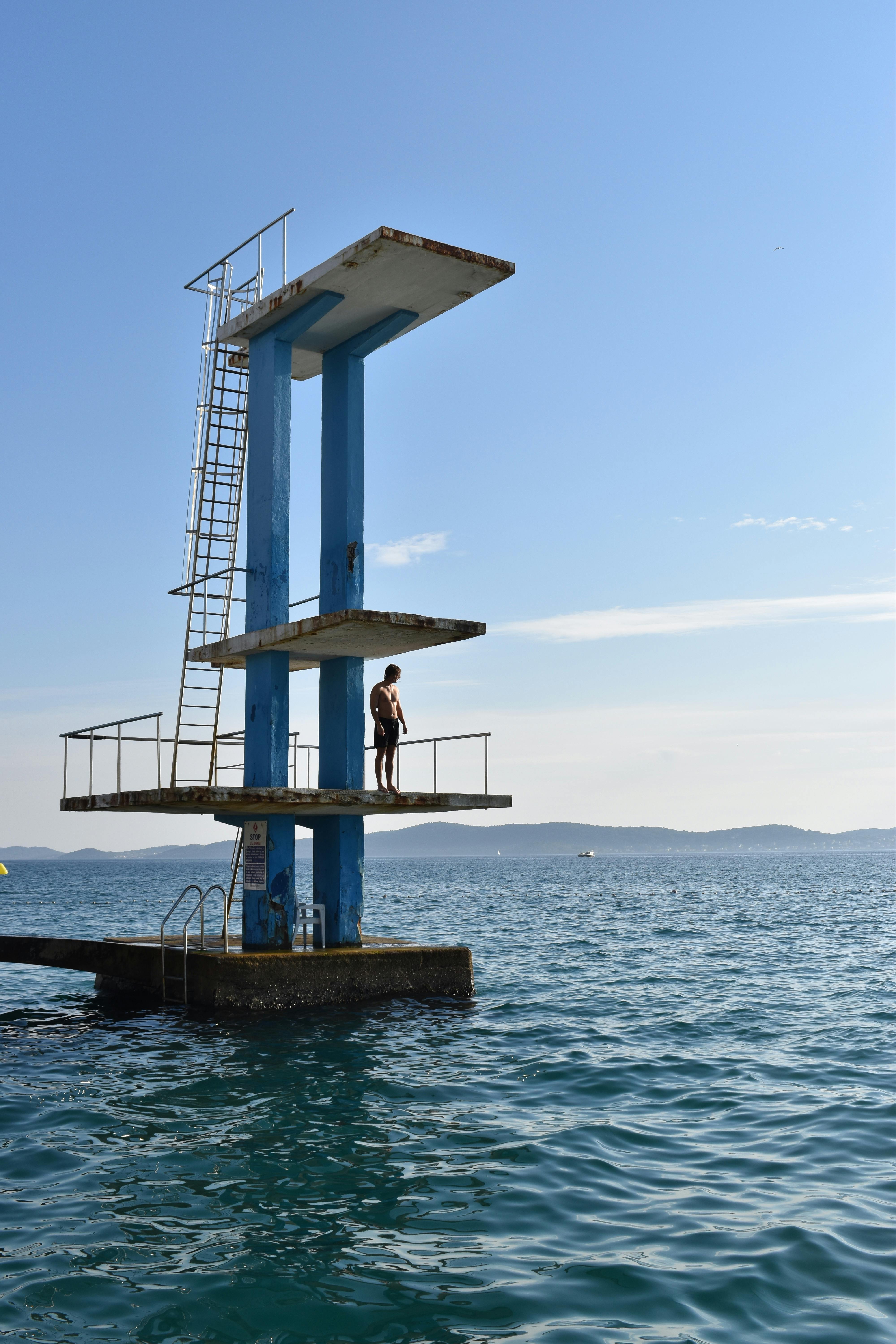 Man Standing on Platform on Water · Free Stock Photo