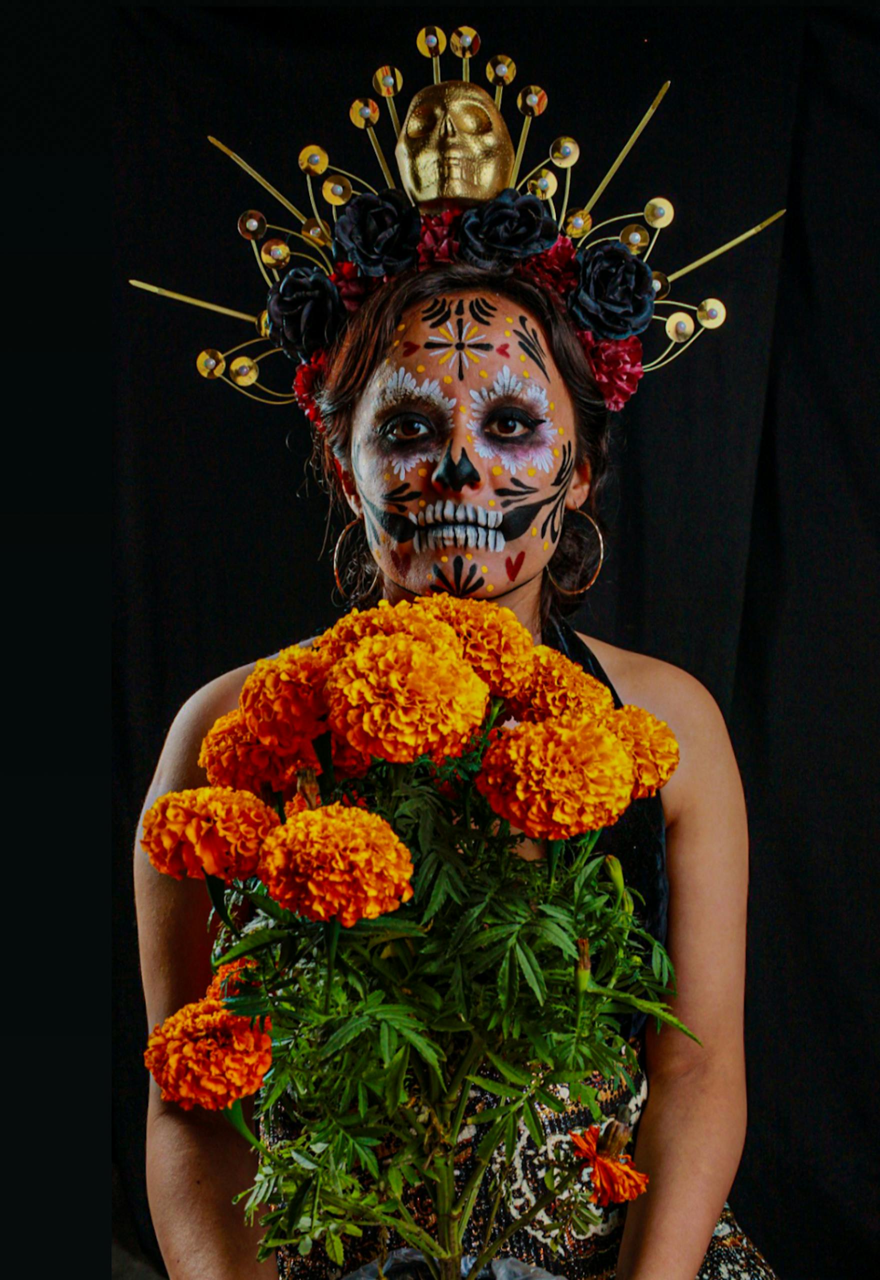 A Woman in Catrina Makeup Wearing a Headdress · Free Stock Photo