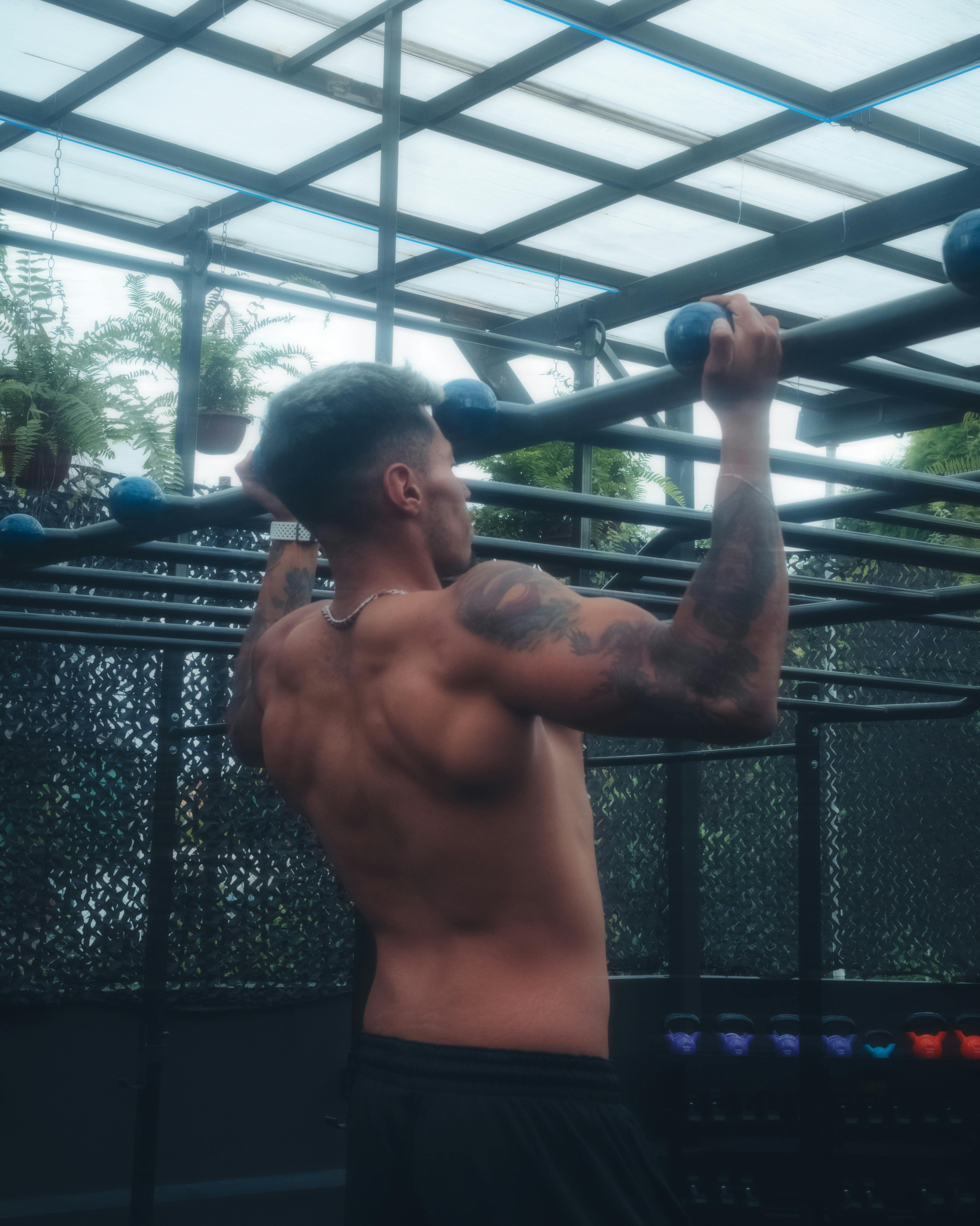 Bearded Man Flexing His Muscles · Free Stock Photo