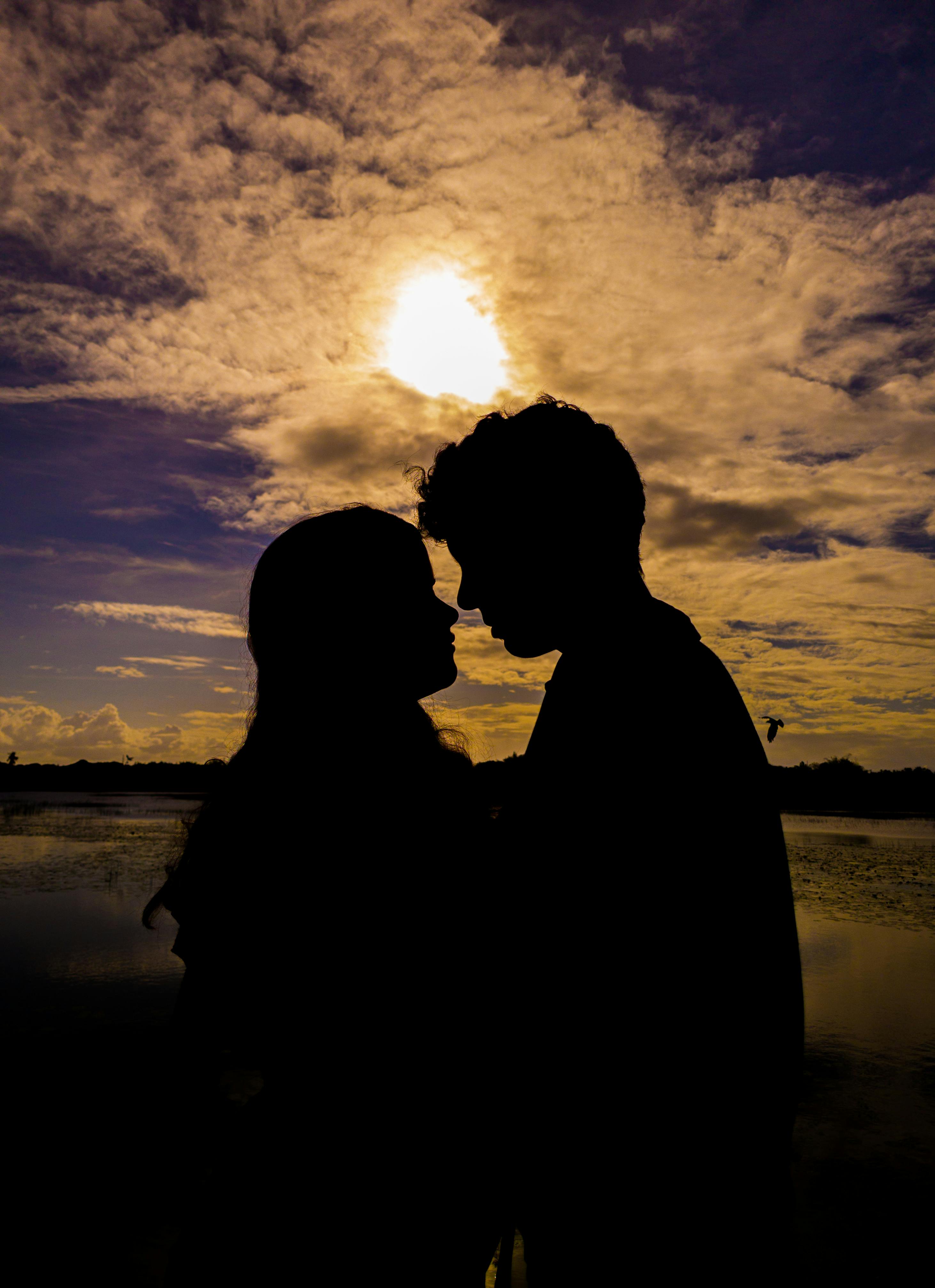 A Silhouette of a Couple during Sunset · Free Stock Photo