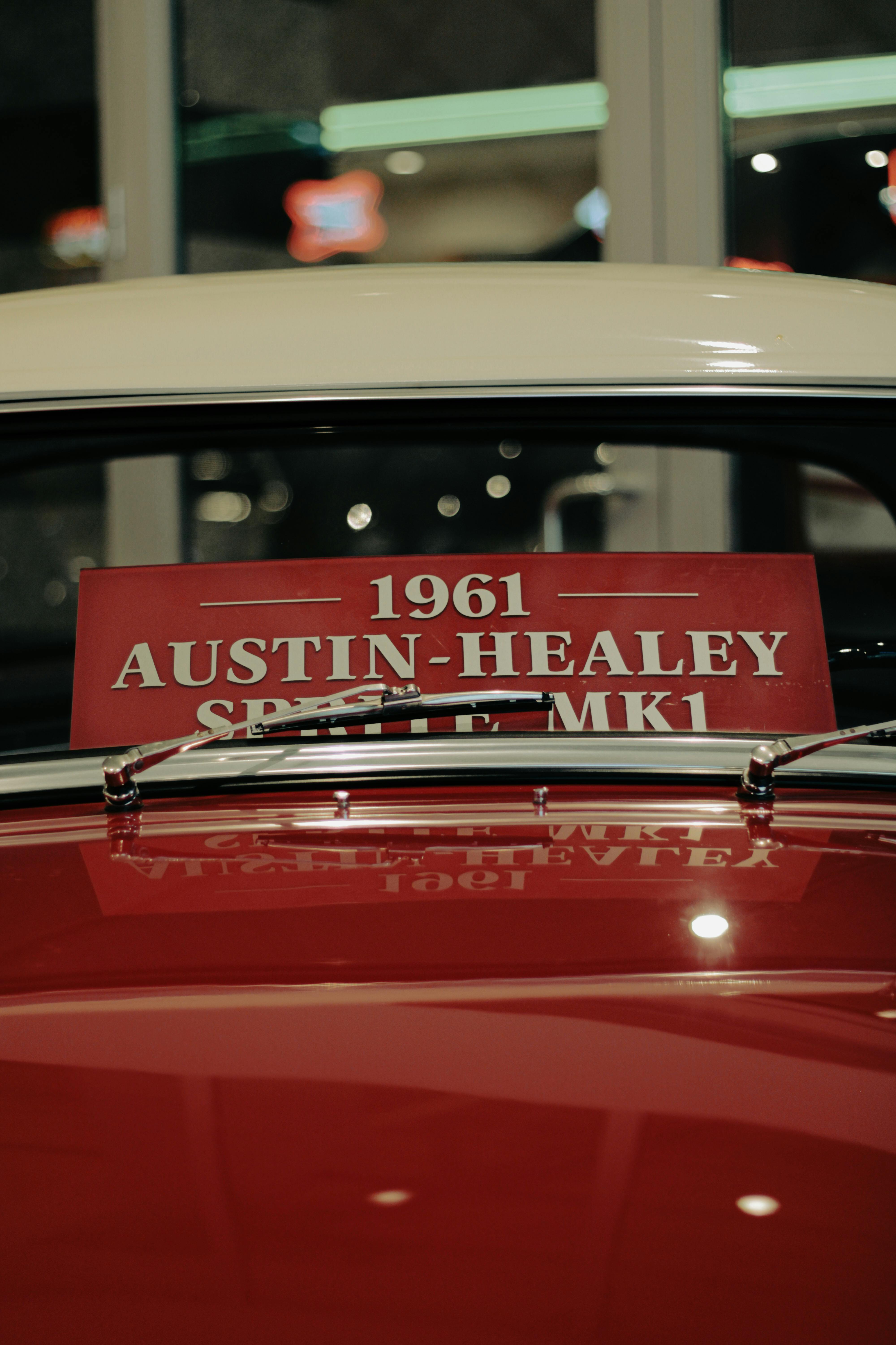 Sign on Front Window of Red Chevrolet Impala · Free Stock Photo