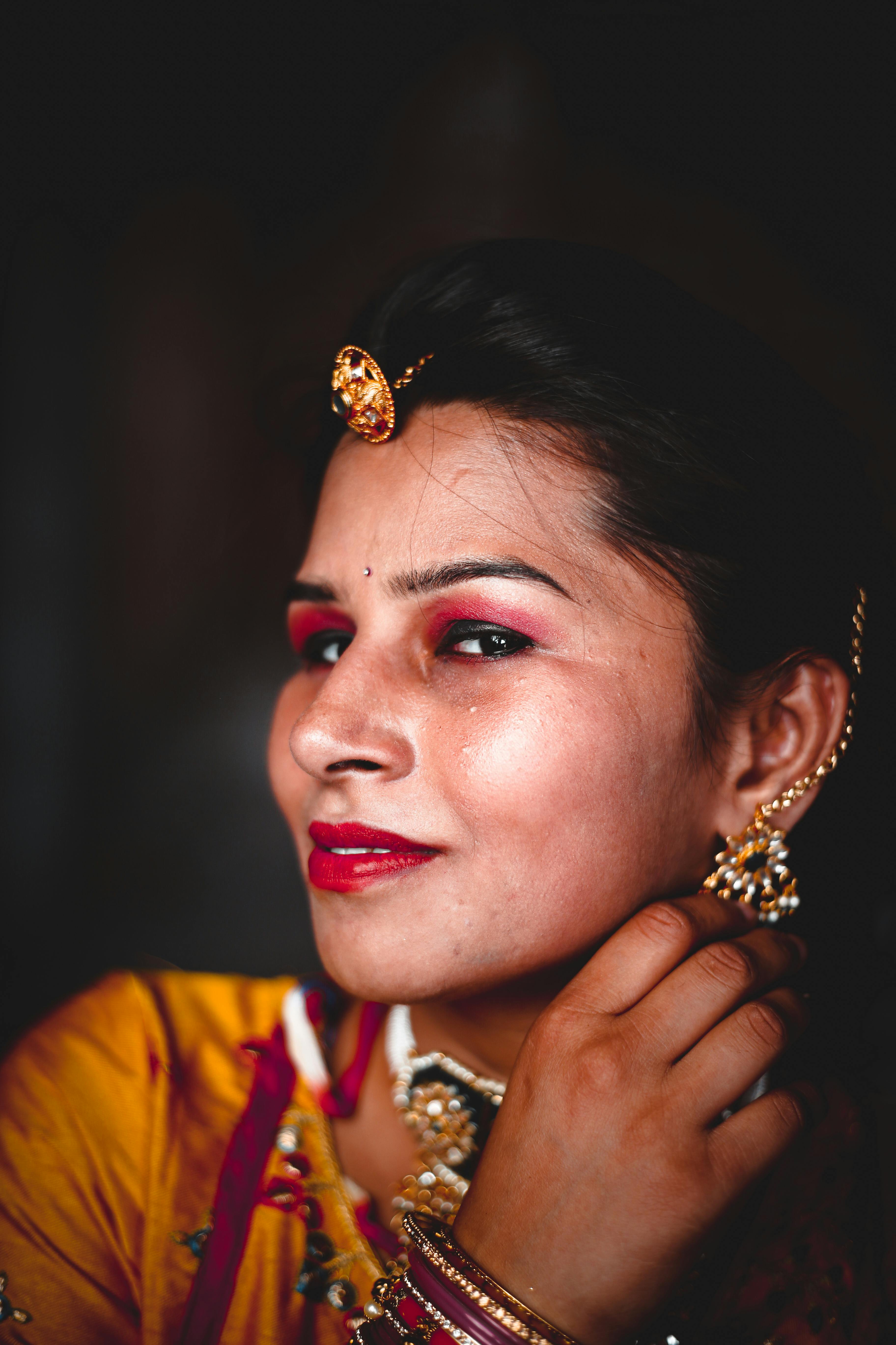 Woman Wearing Makeup and Dangling Earrings · Free Stock Photo