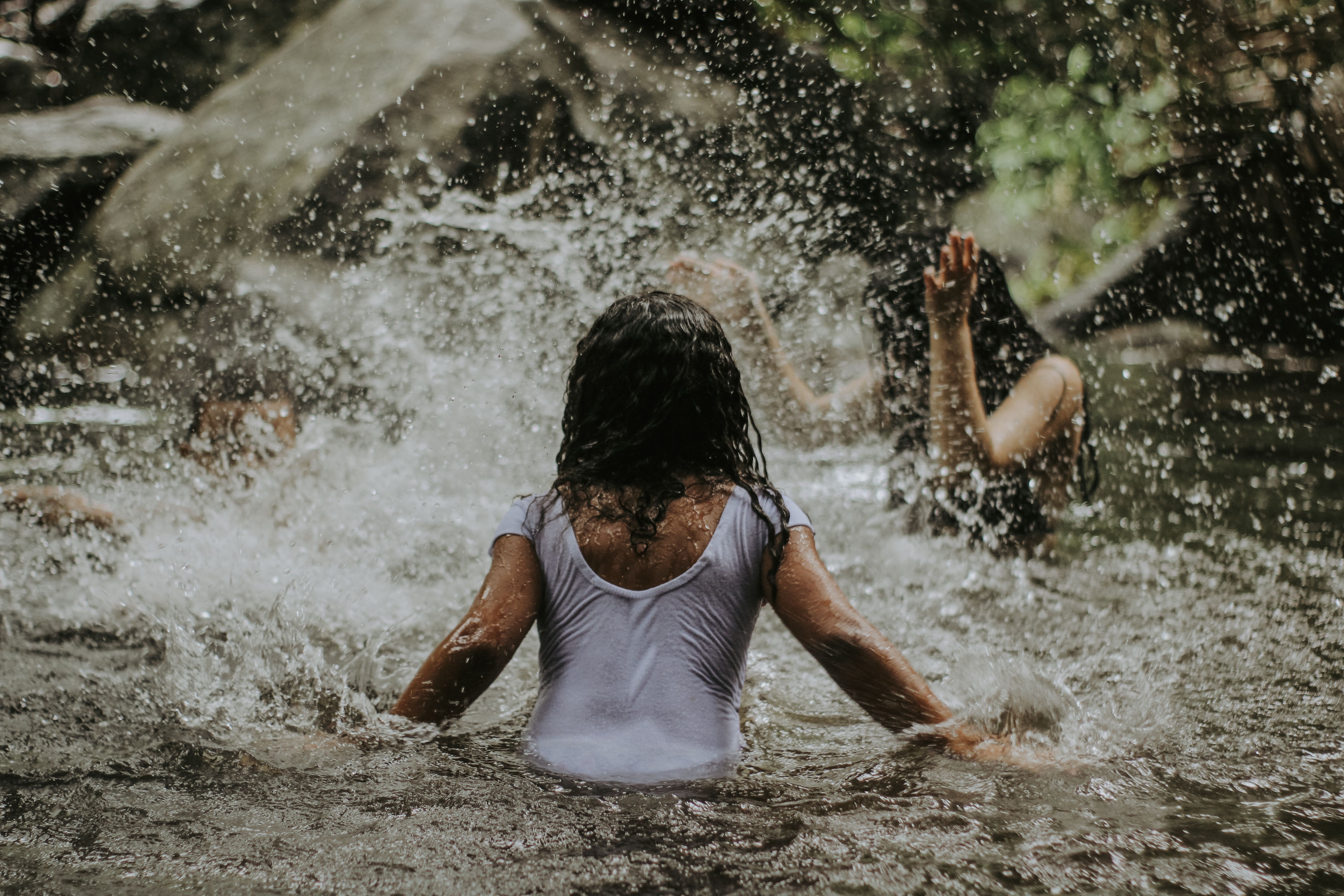 Women Playing while Soaking on Water · Free Stock Photo