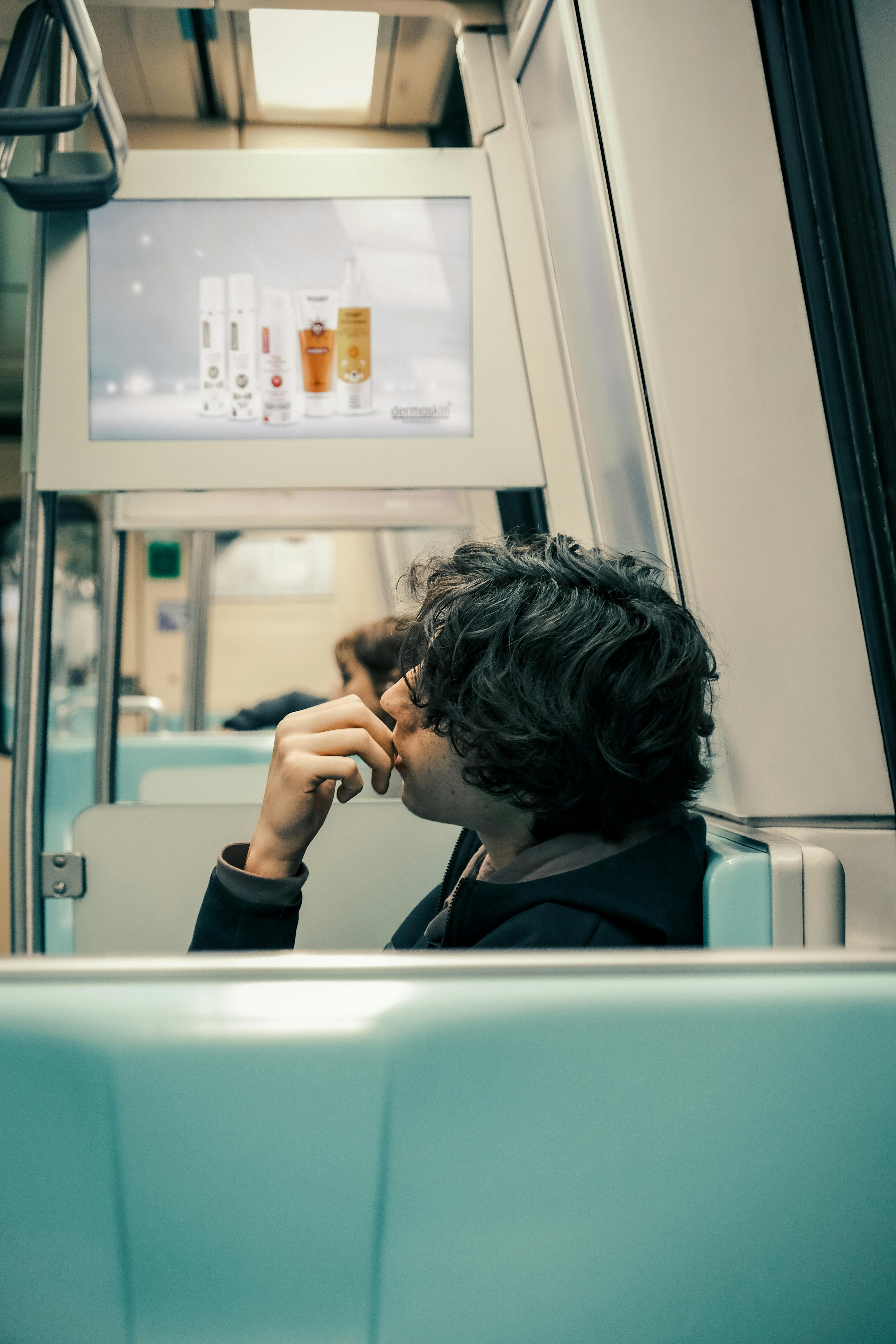 A Man Sitting on a Train · Free Stock Photo