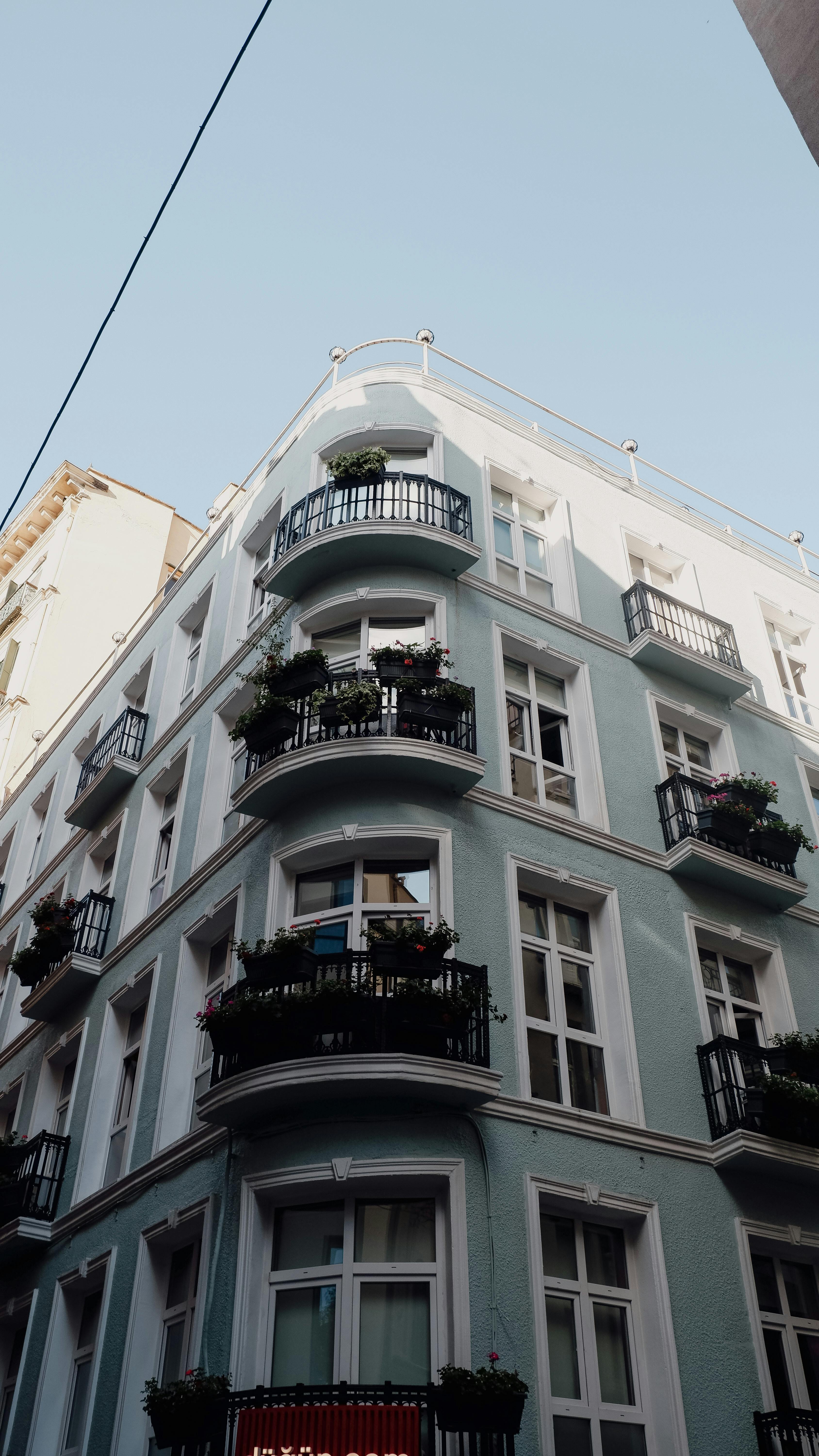 Gray Apartment Building with Balconies · Free Stock Photo