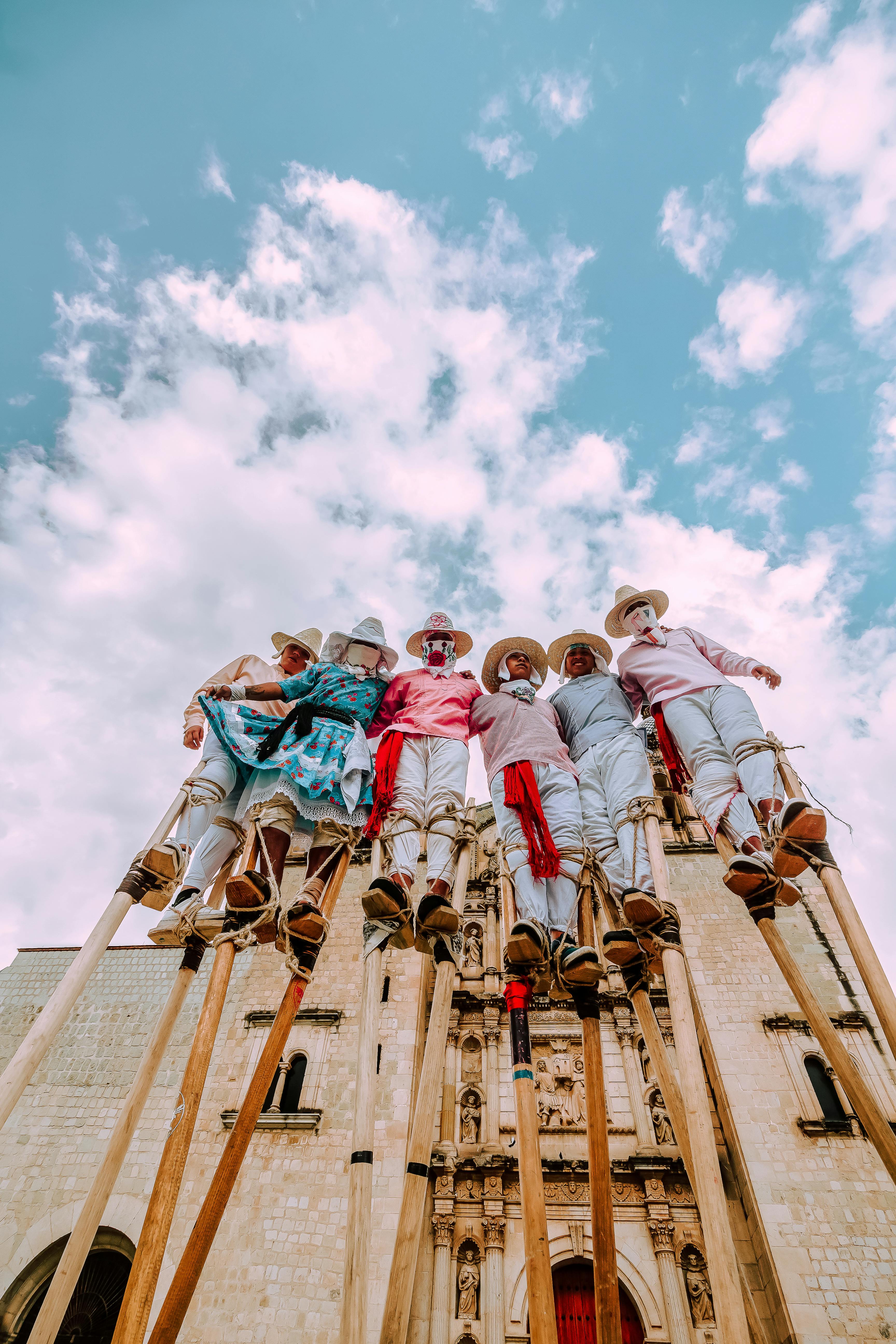 Low Angle Shot of a Group of People in Costumes on Stilts · Free Stock ...