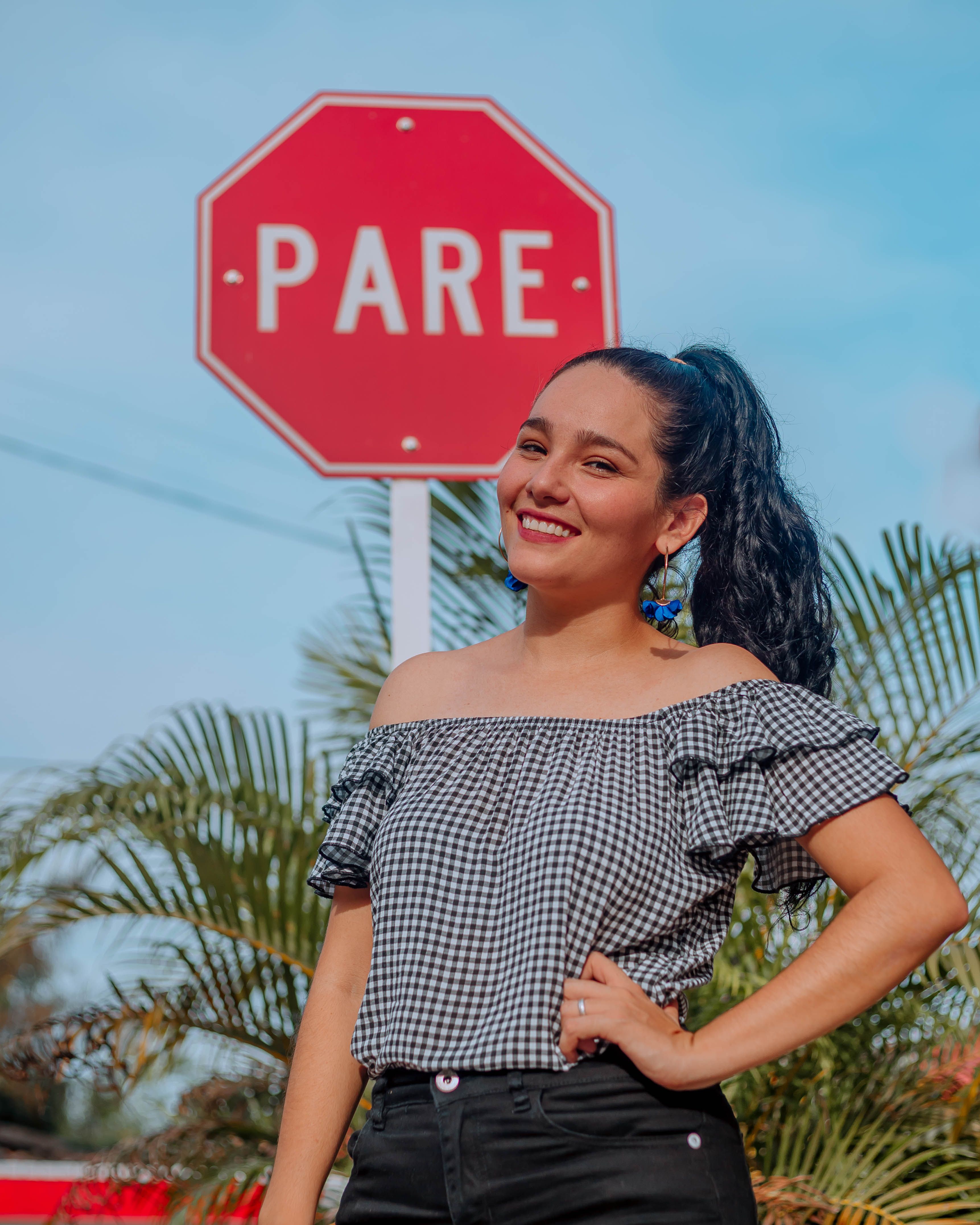 Woman Standing Putting Her Hand on Bench · Free Stock Photo