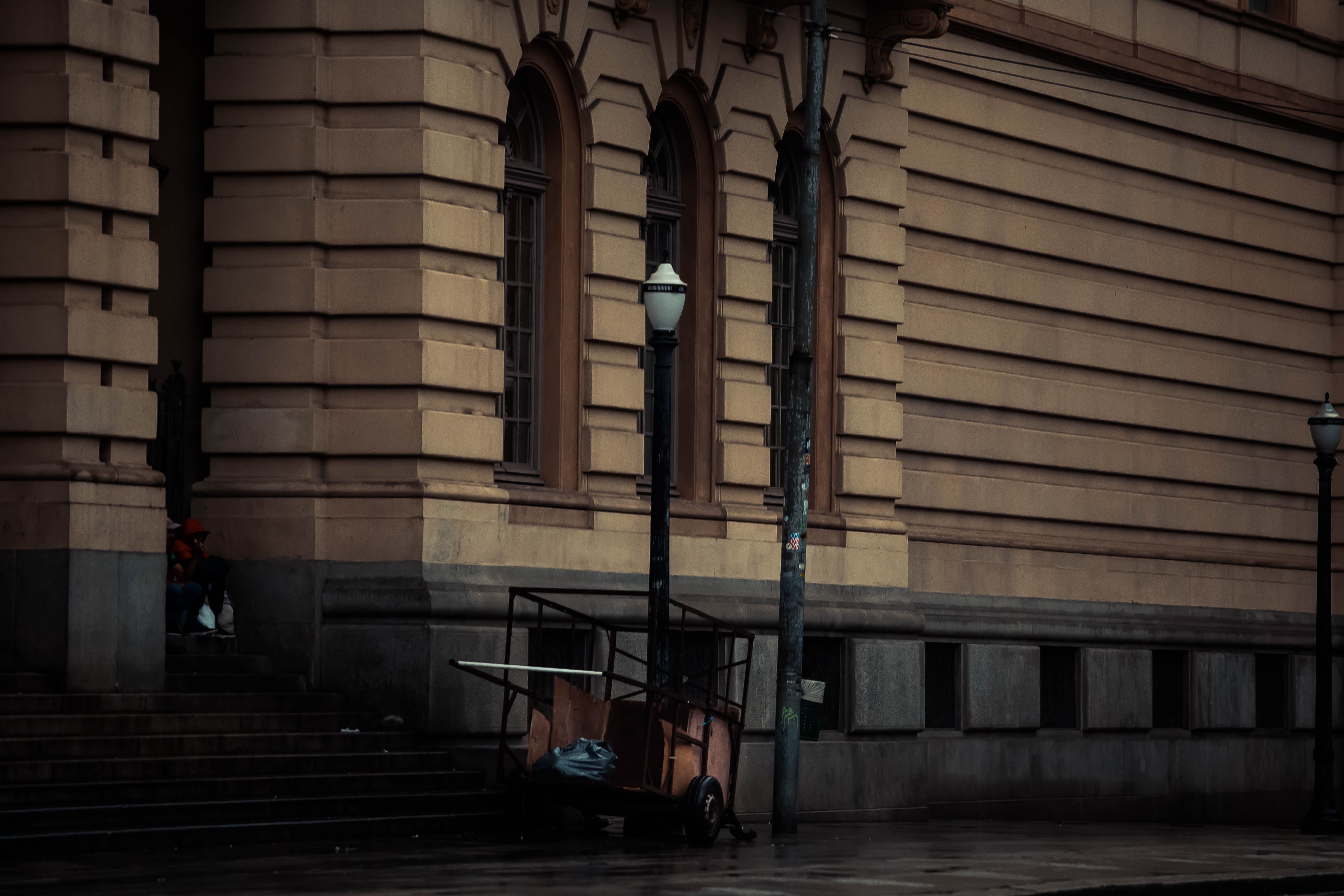 People on Sitting Building Steps · Free Stock Photo