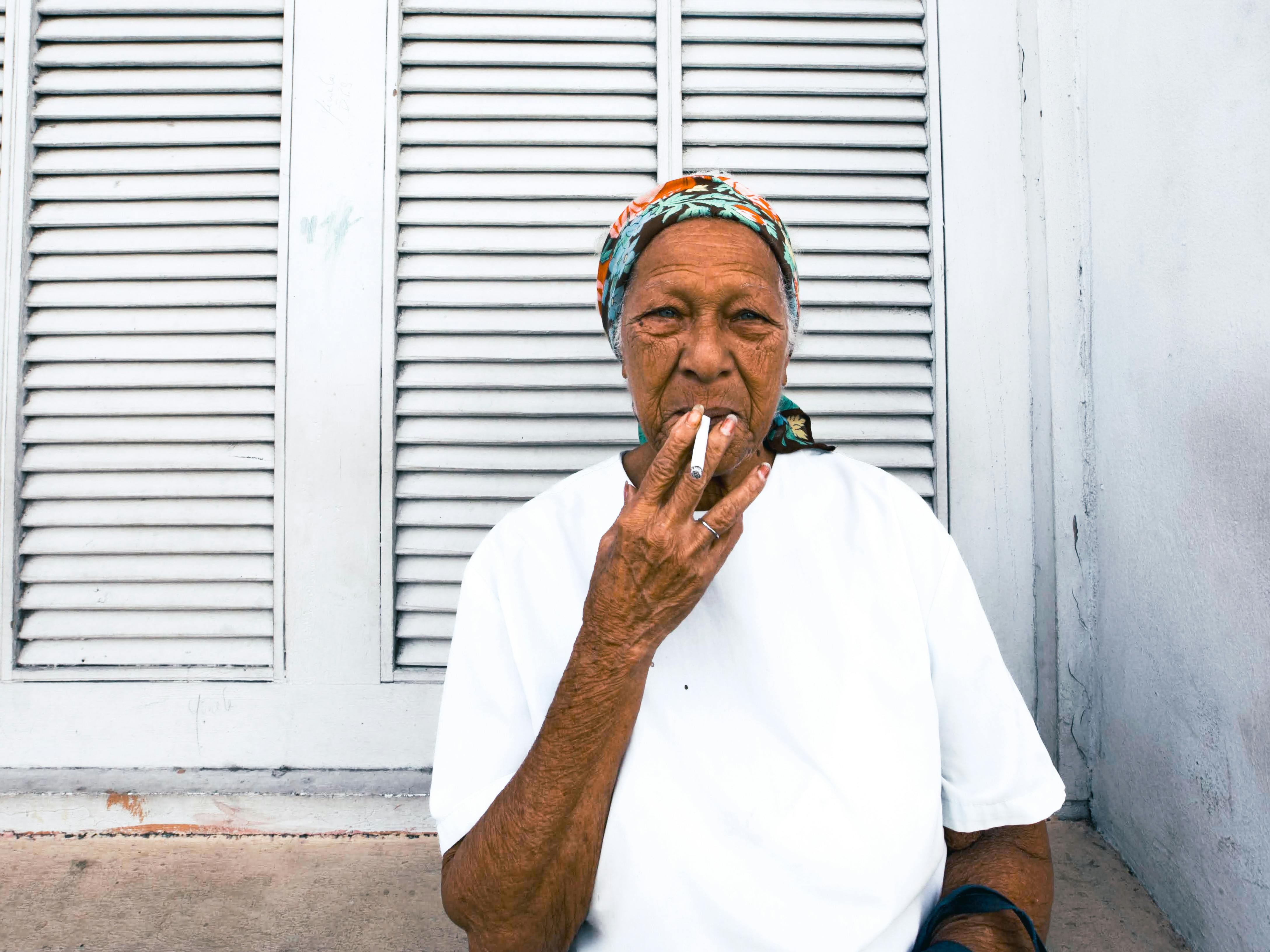 Woman Smoking in the Kitchen · Free Stock Photo