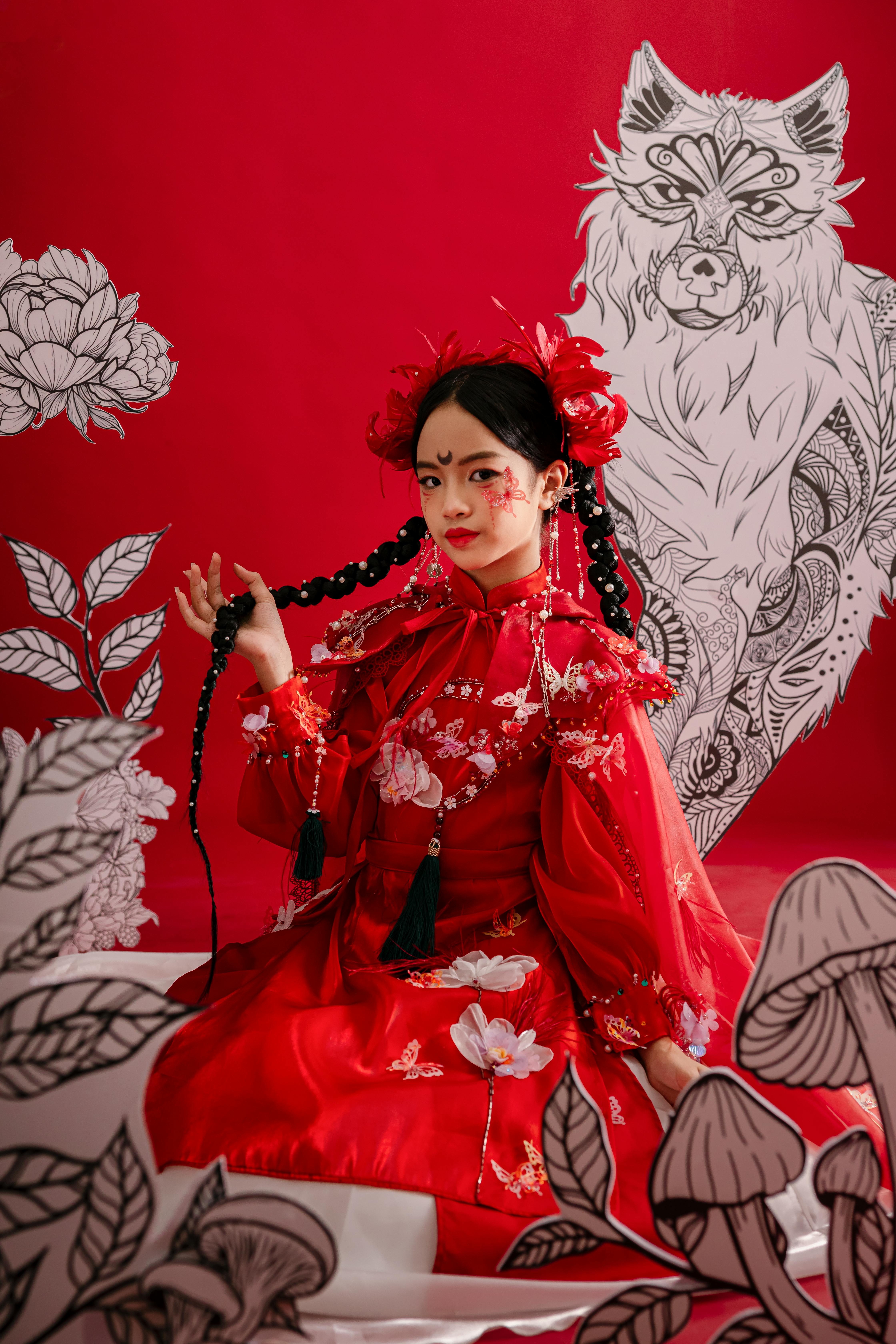 A Girl in Red Hanfu Sitting while Looking Afar · Free Stock Photo