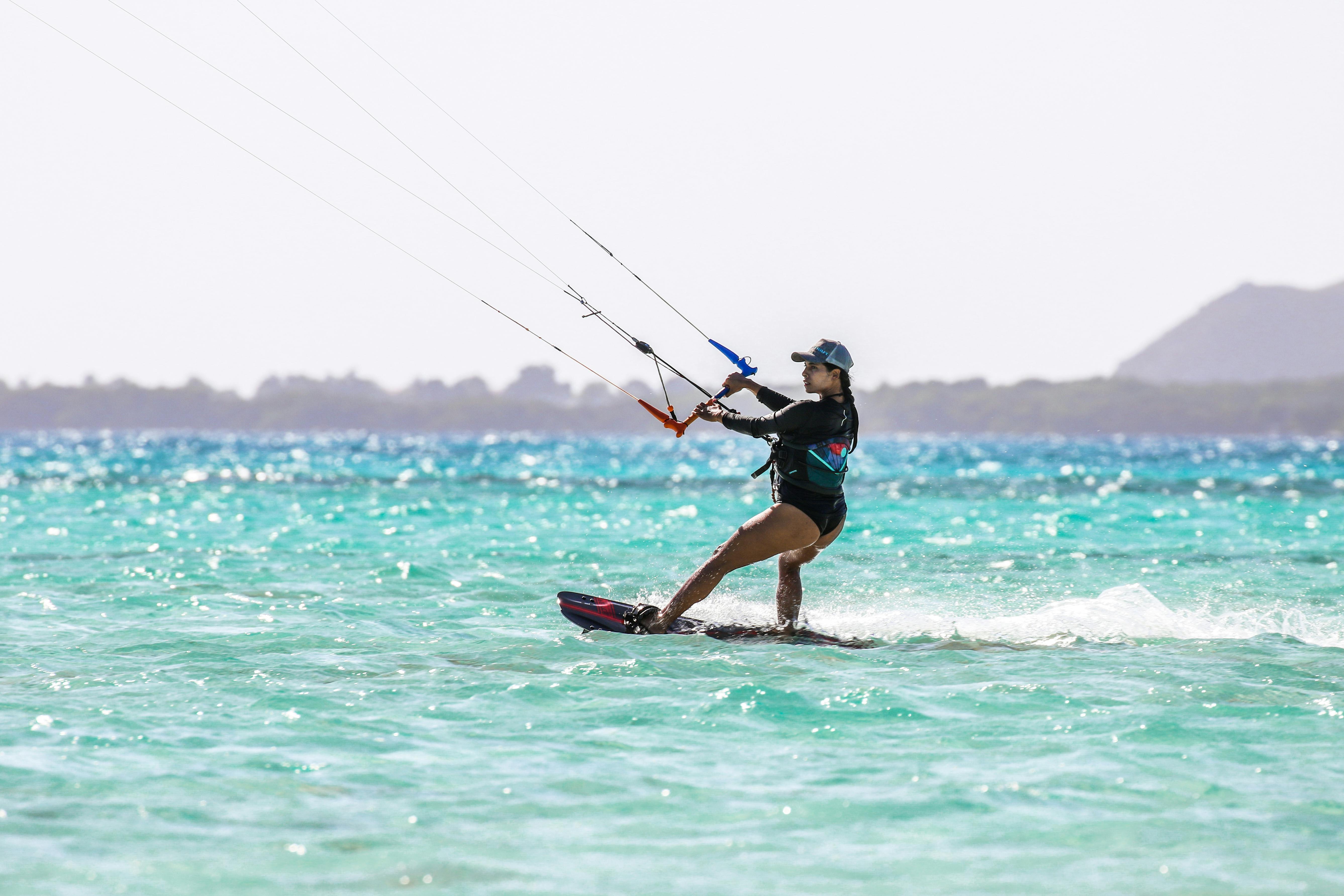 A Woman Kitesurfing on the Sea · Free Stock Photo