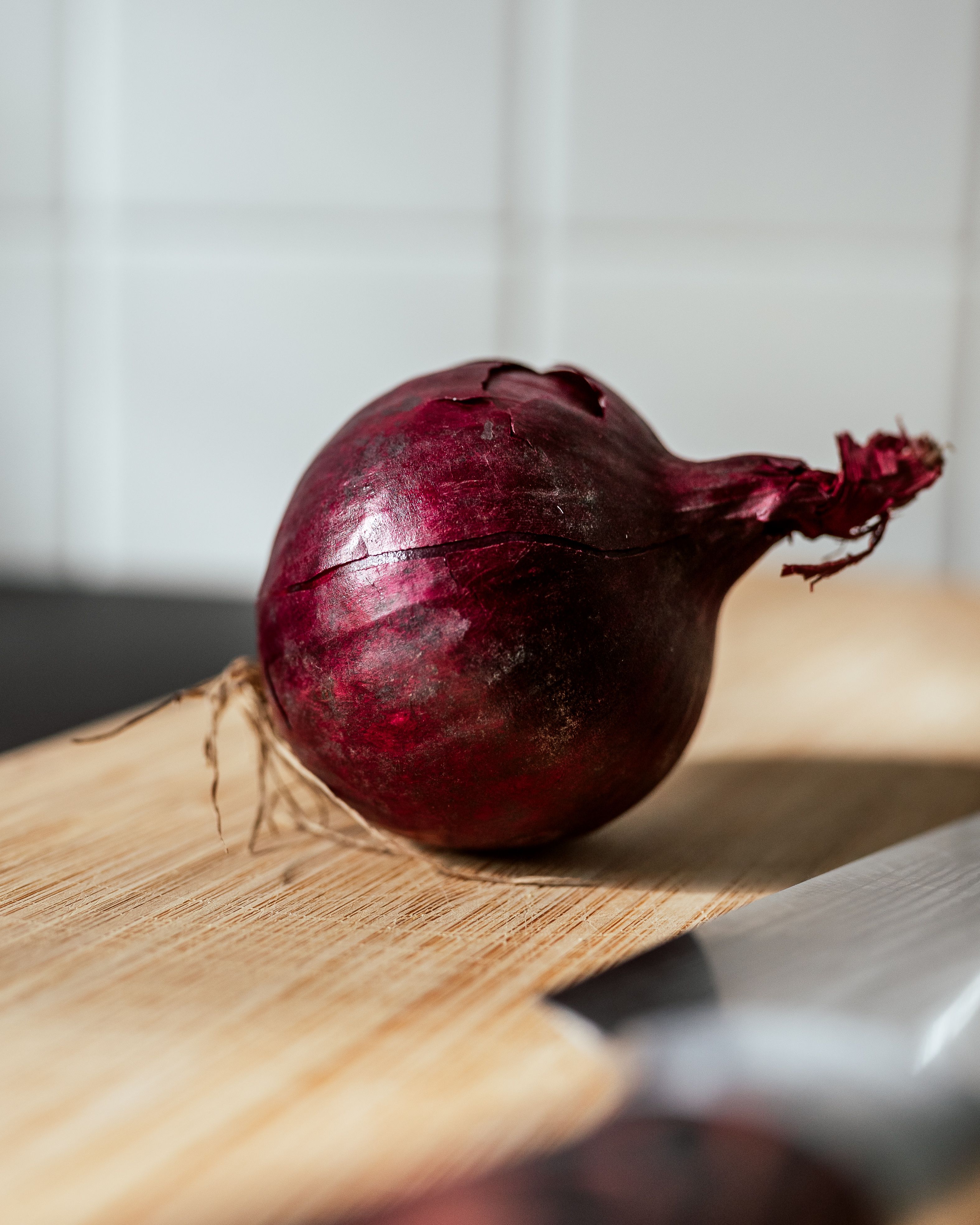 Red Onion on Wooden Chopping Board · Free Stock Photo