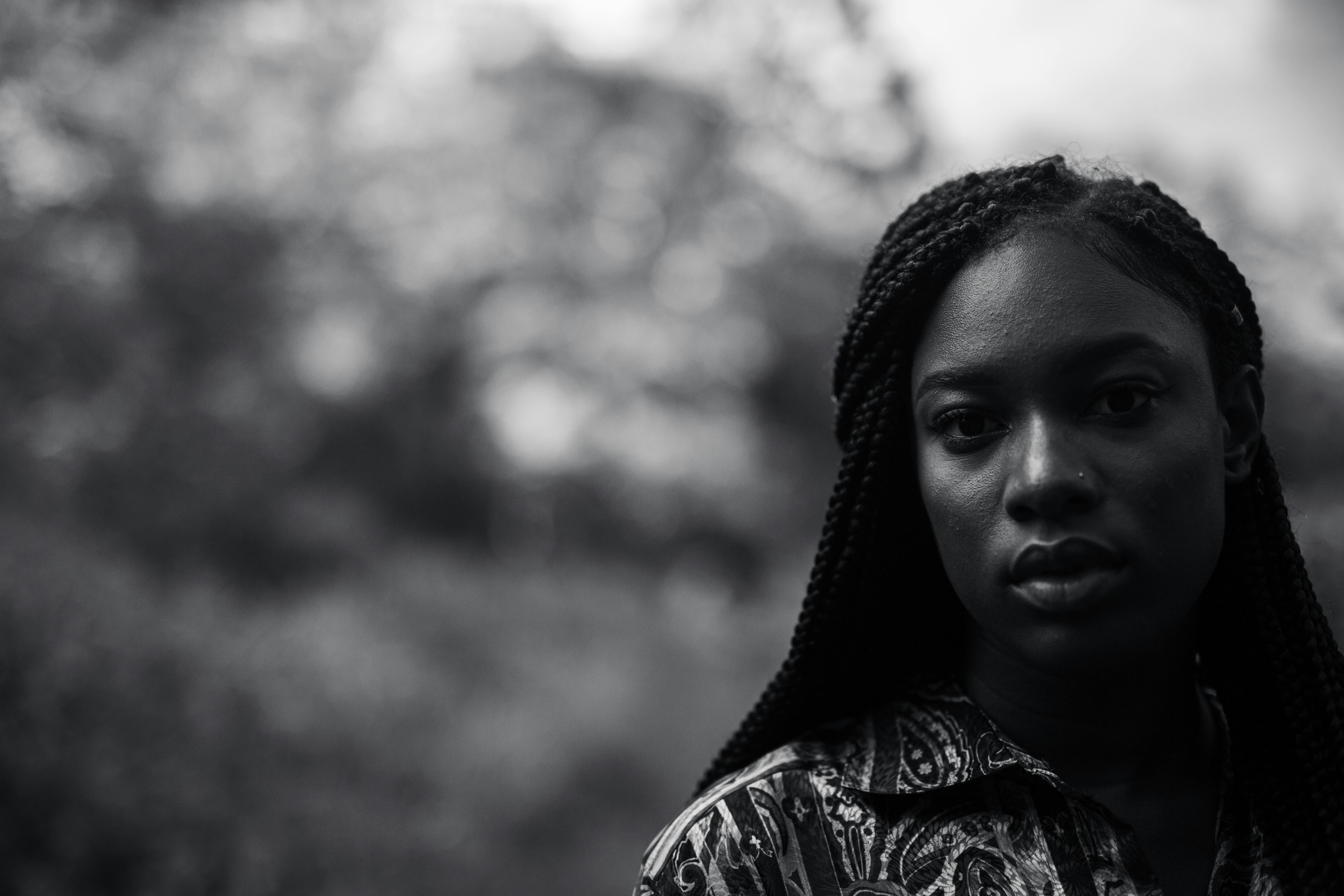 Grayscale Photo of a Woman with Braided Hair · Free Stock Photo