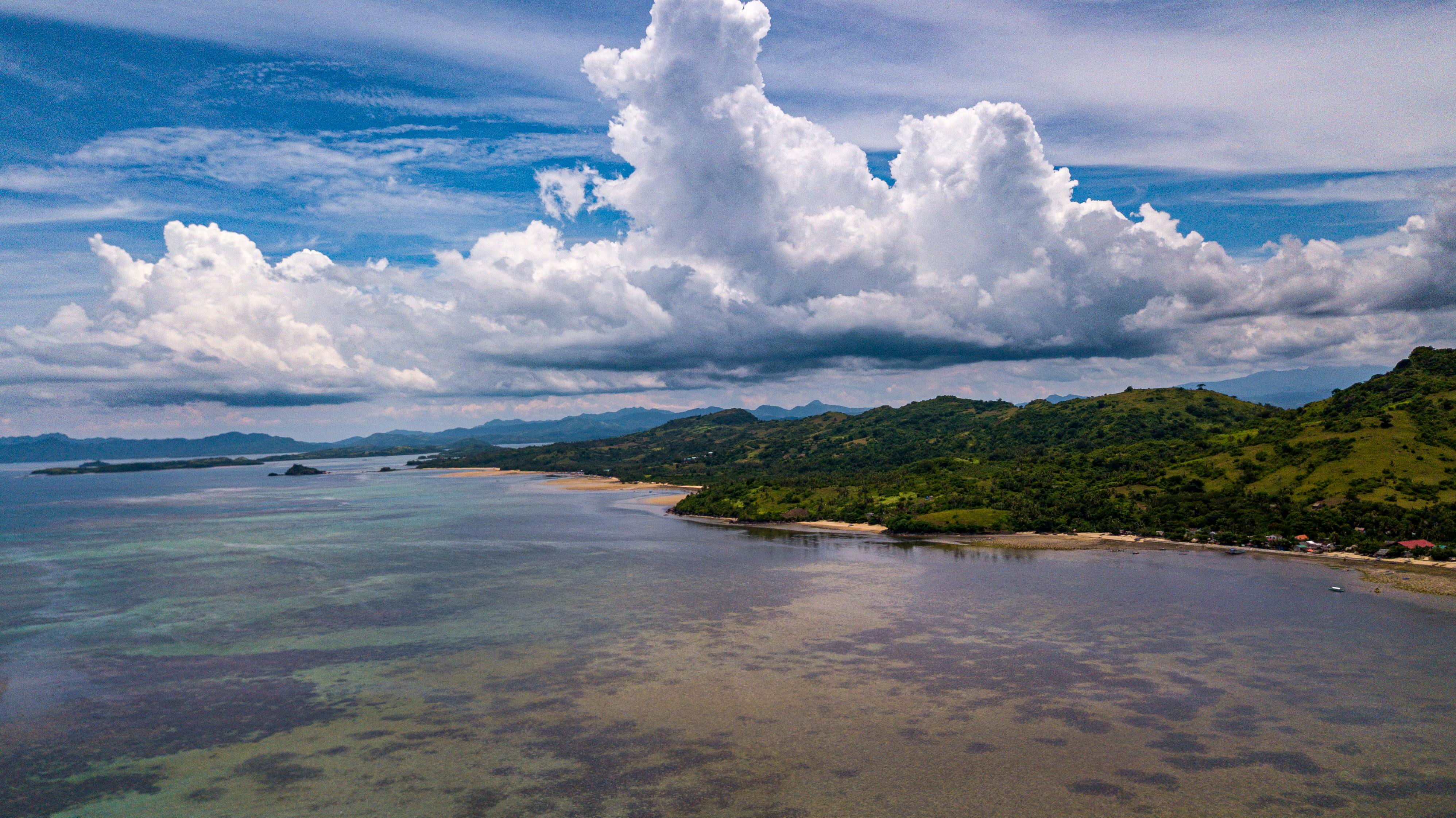 Majestic Clouds over Island · Free Stock Photo