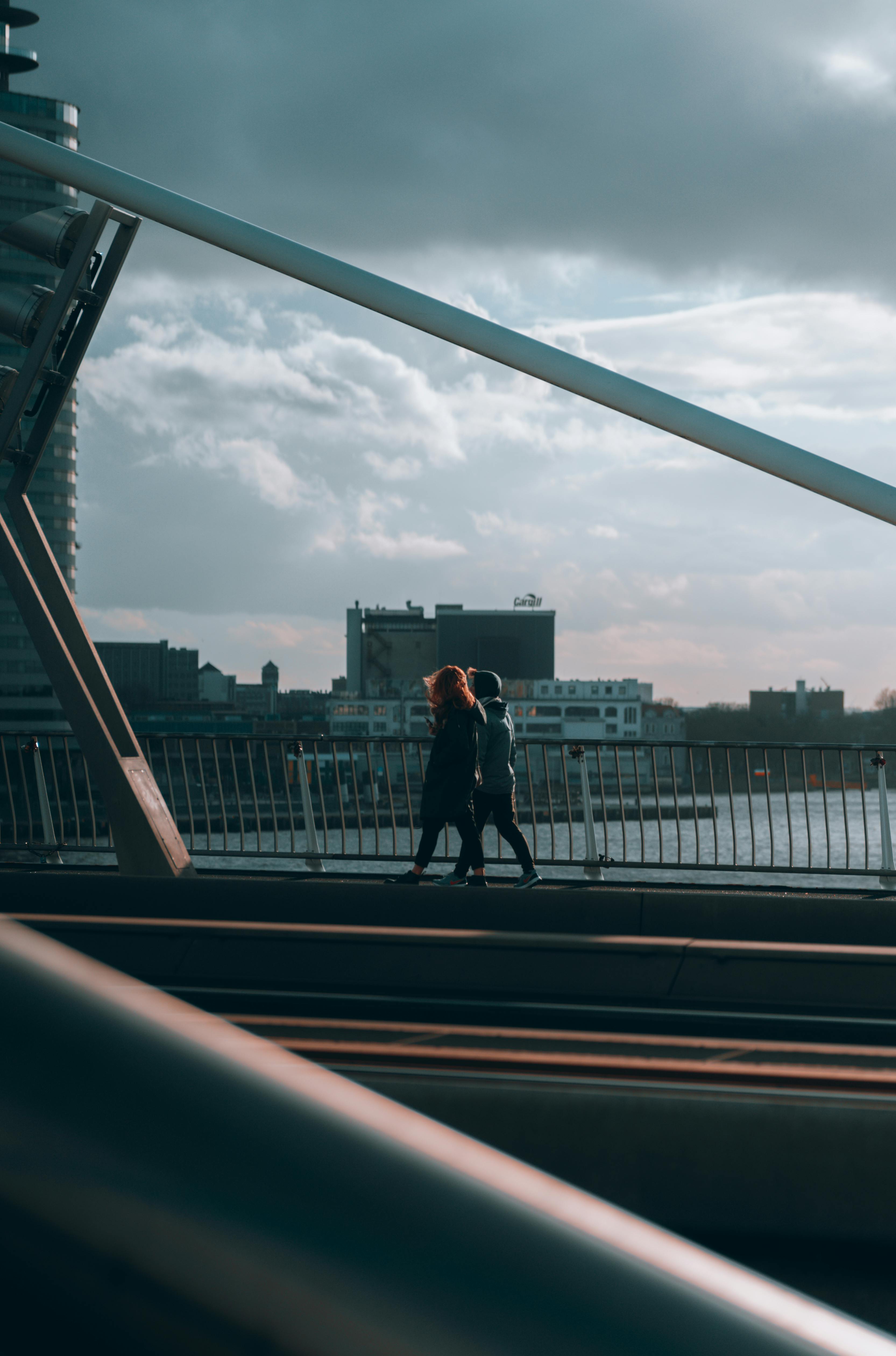 People Walking on the Side of the Bridge · Free Stock Photo